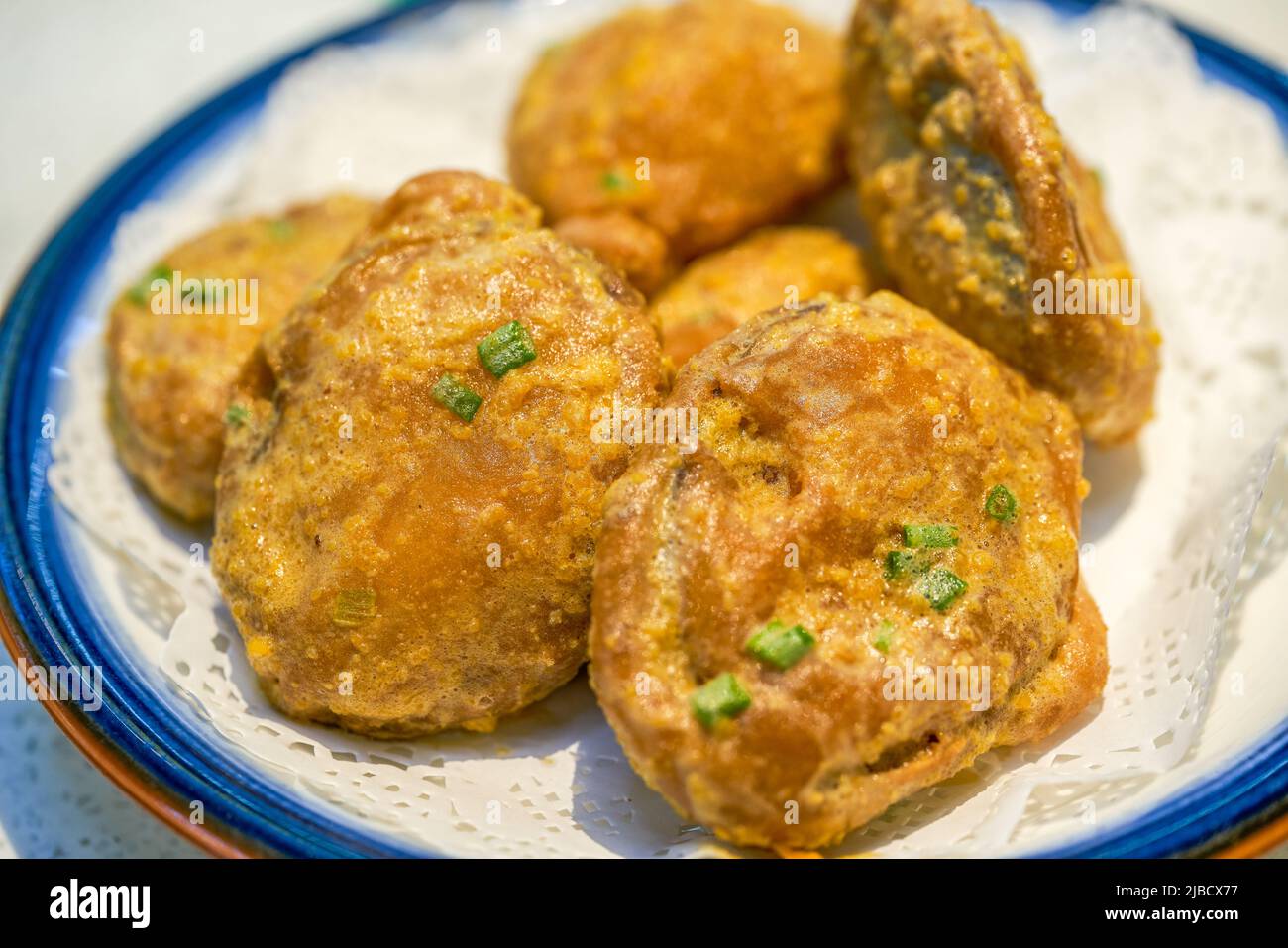 A delicious Chinese dish, fried pork and lotus root cake Stock Photo ...
