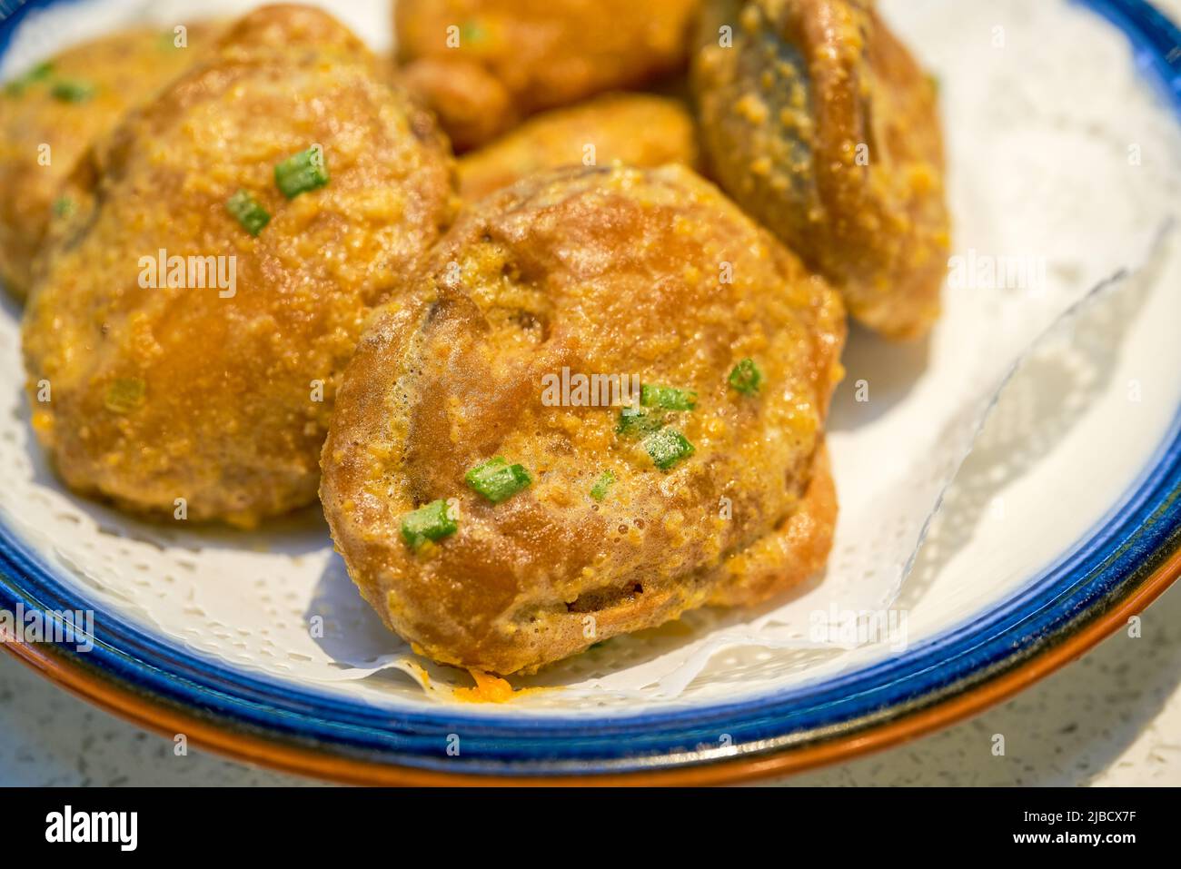 A delicious Chinese dish, fried pork and lotus root cake Stock Photo ...