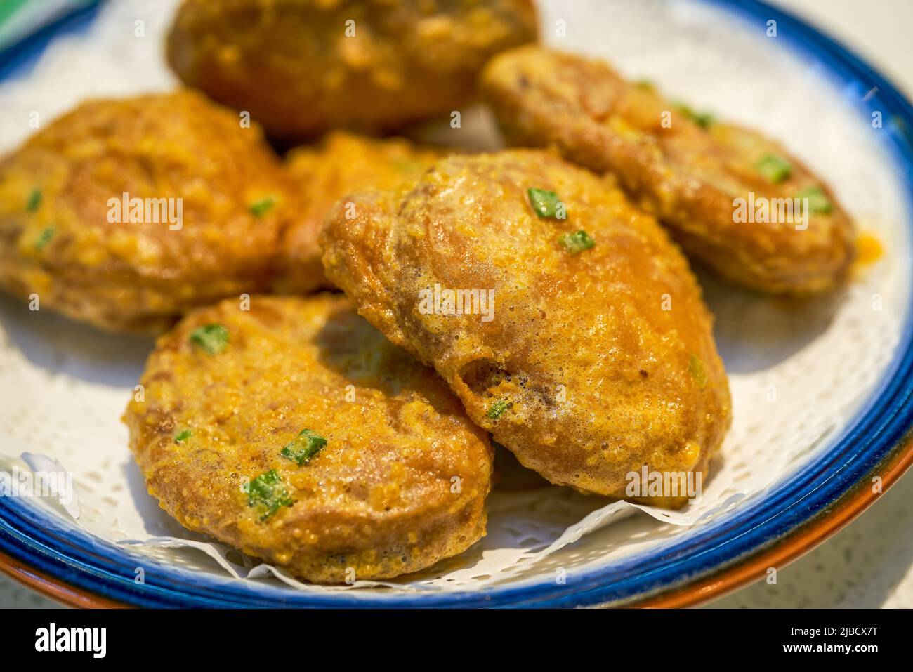 A delicious Chinese dish, fried pork and lotus root cake Stock Photo ...
