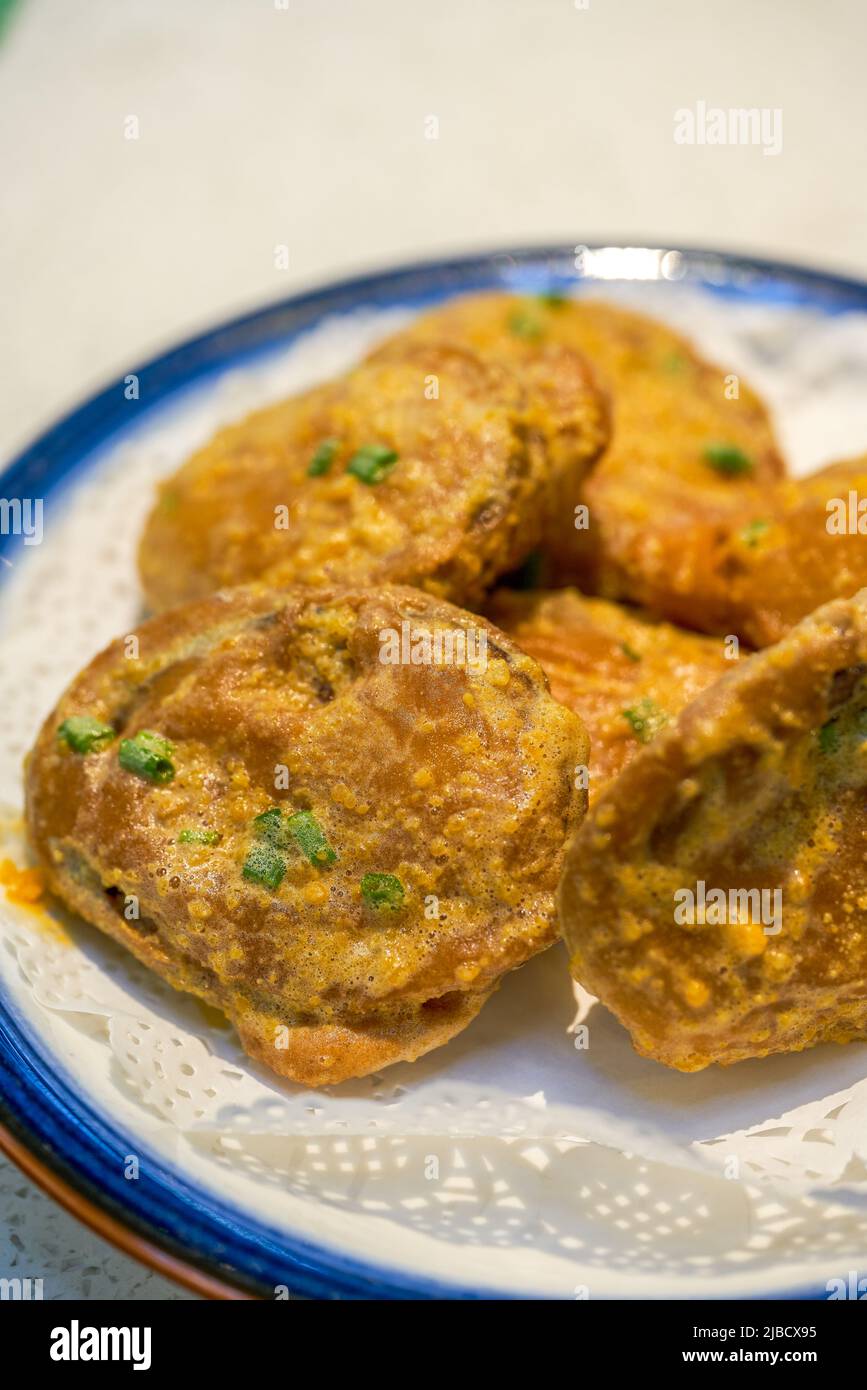 A delicious Chinese dish, fried pork and lotus root cake Stock Photo ...