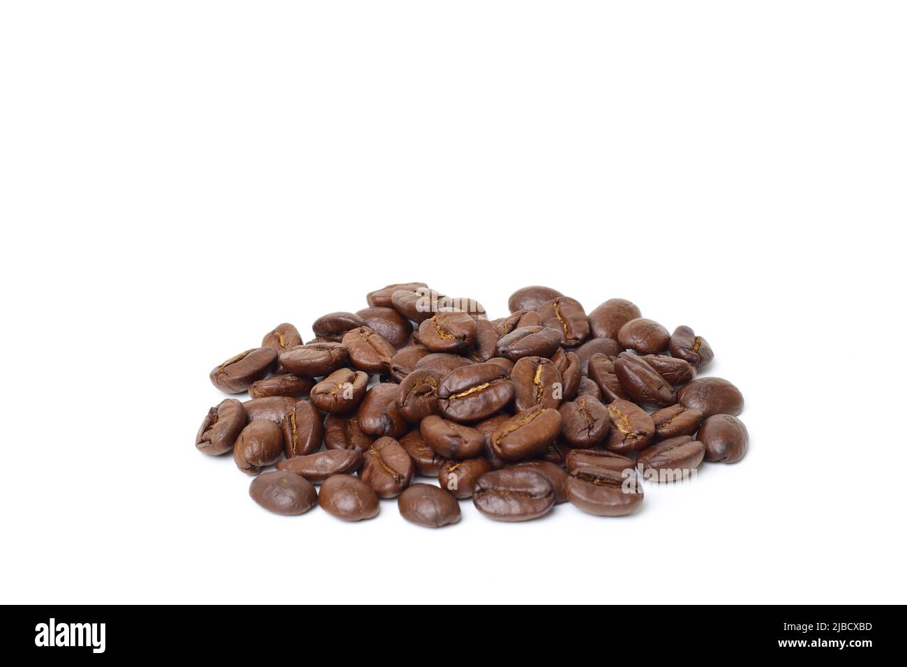 Roasted coffee beans on white. Brown roasted coffee beans isolated on ...