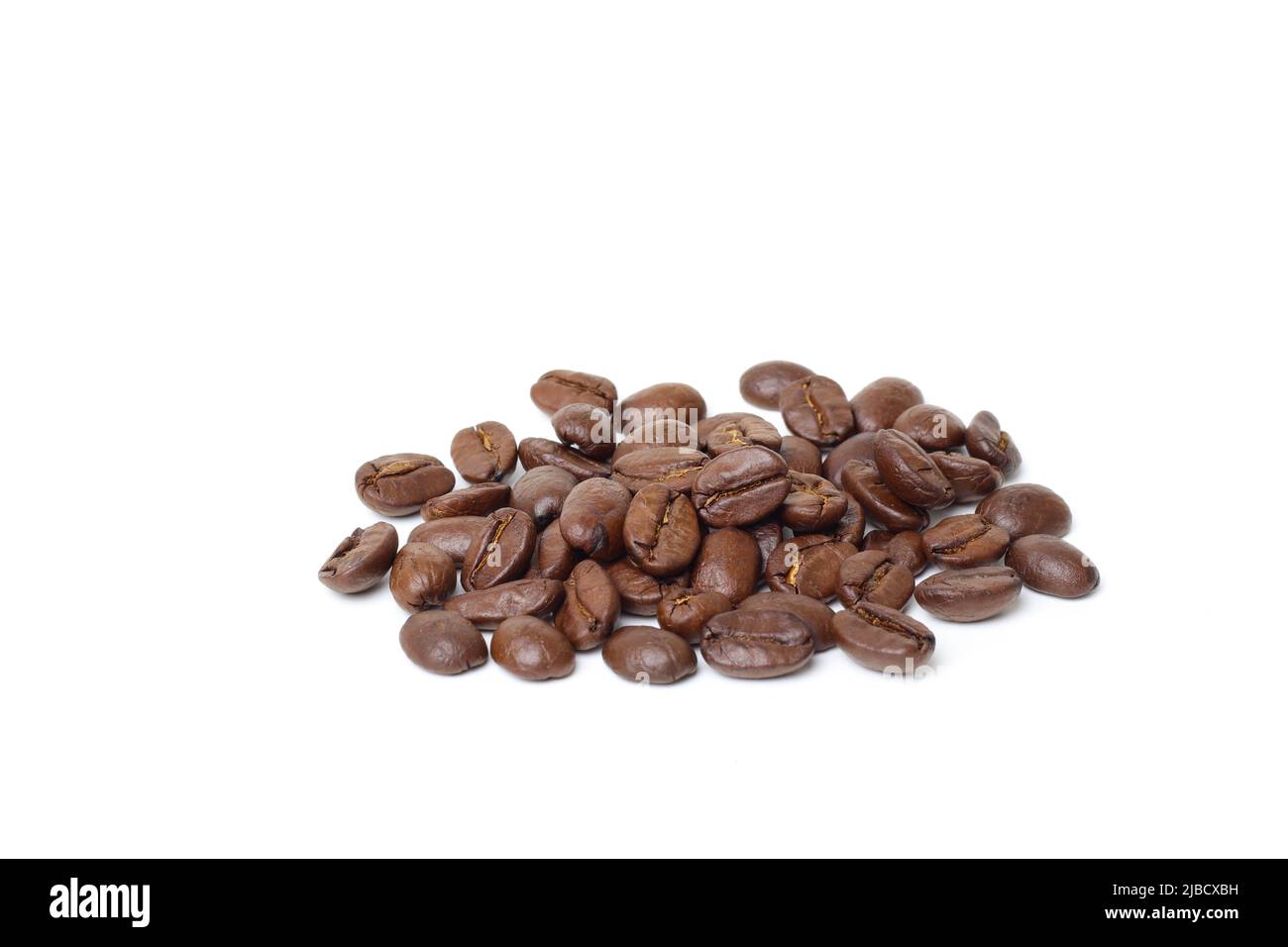 Roasted coffee beans on white. Brown roasted coffee beans isolated on ...