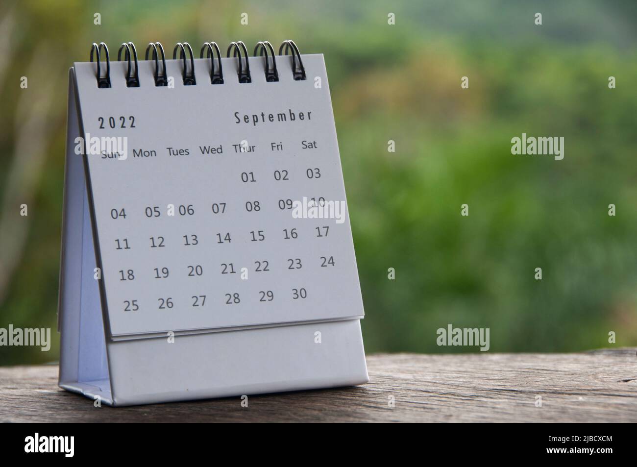 September month calendar with blurred nature background. Copy space ...