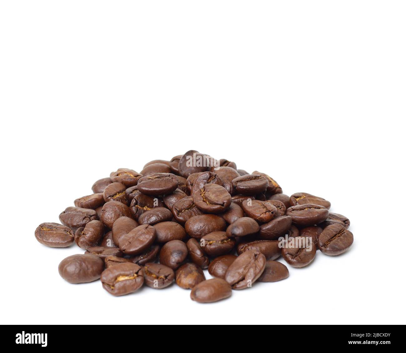 Roasted coffee beans on white. Brown roasted coffee beans isolated on ...