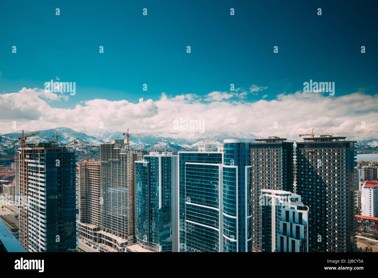 New Residential Multi-storey Houses On Blue Sky. Real Estate ...