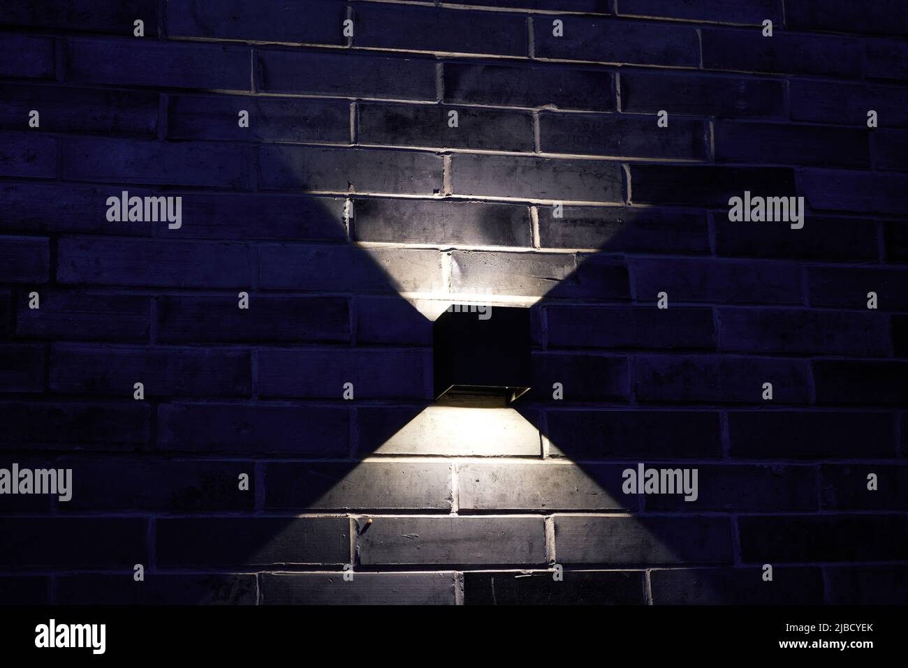 A modern wall mounted street lamp with up and down lighting in the ...