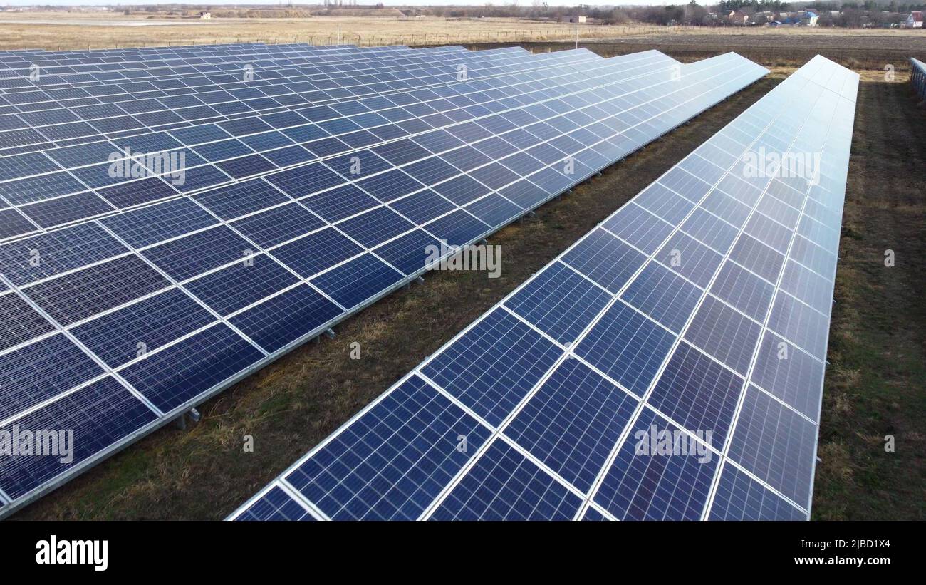 Aerial drone view flight over solar power station panels. Aerial top ...