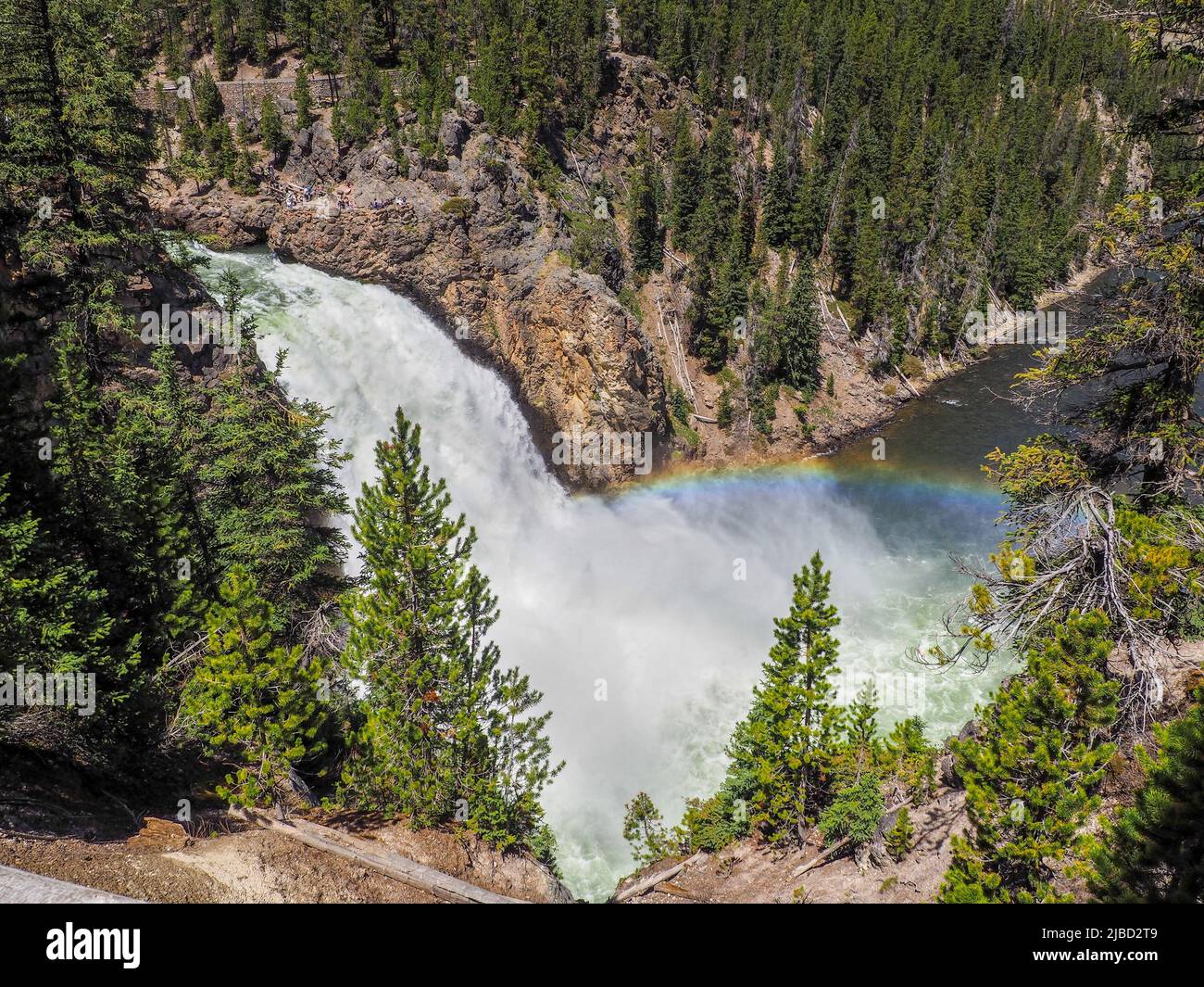 High angle shot of mighty Upper falls of Yellowstone with rainbow upon ...