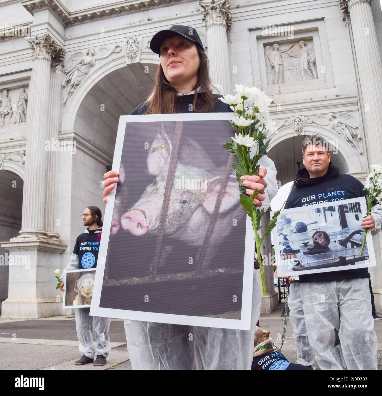 London, England, UK. 5th June, 2022. An activist holds a picture of a ...