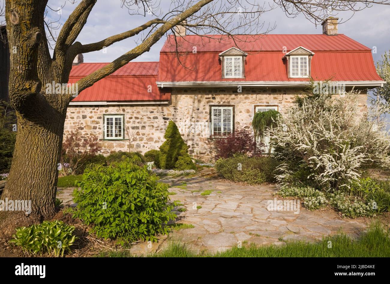 Old 1838 Canadiana fieldstone cottage style home with red sheet metal ...
