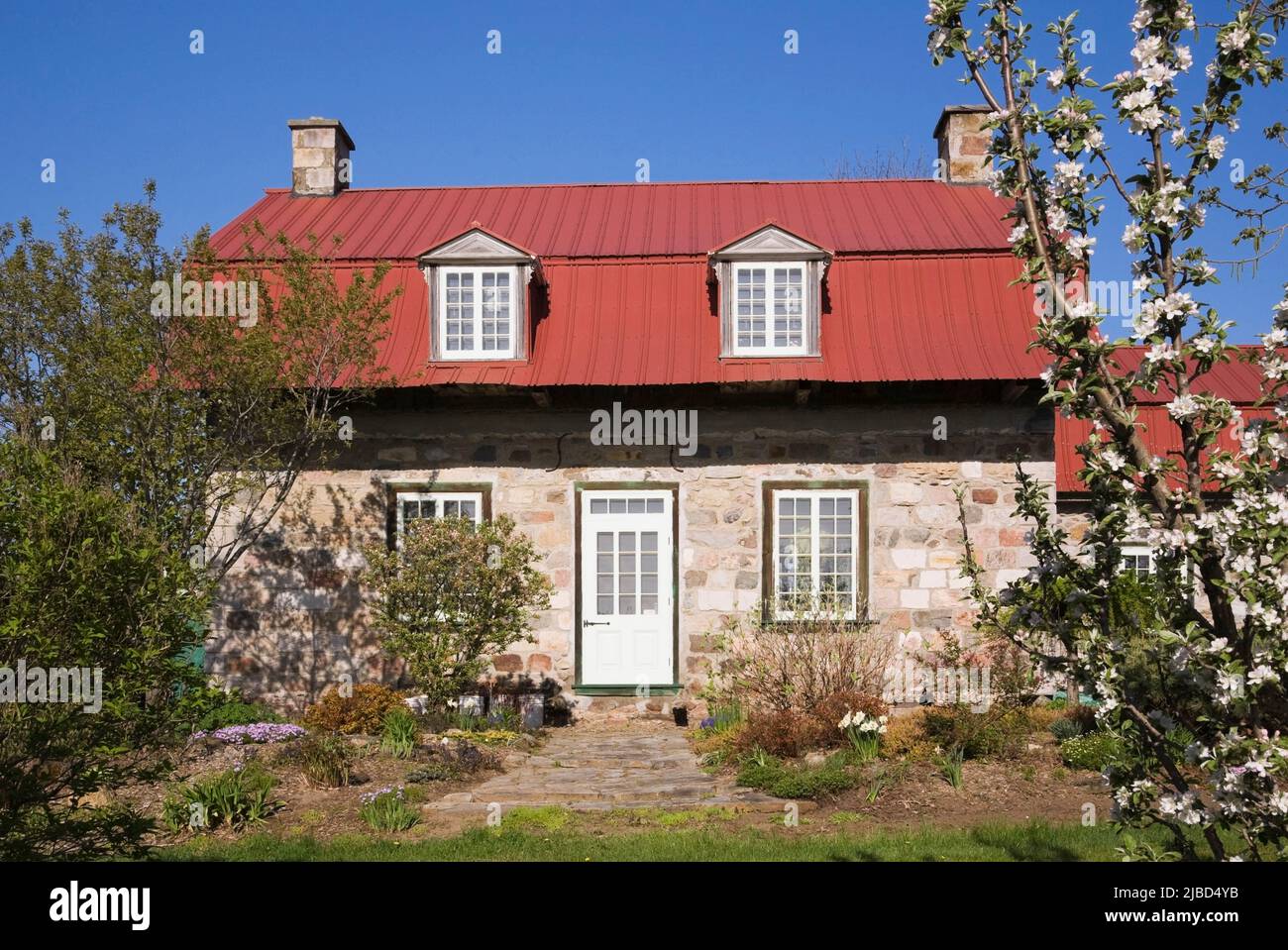 Old 1838 Canadiana fieldstone cottage style home with red sheet metal ...