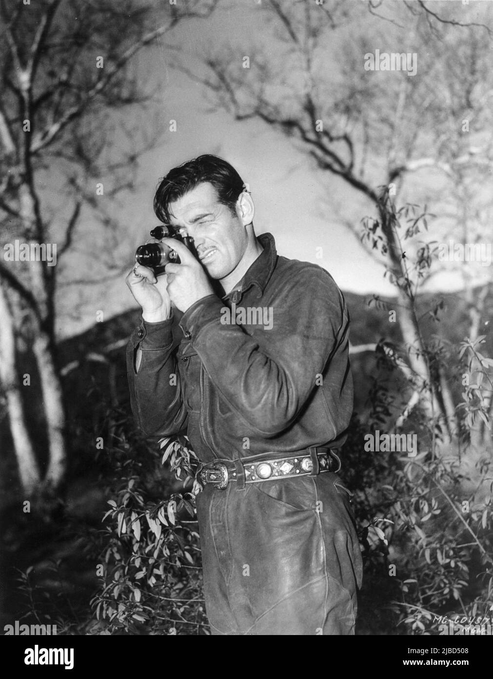 CLARK GABLE on Hunting Trip with Still Camera in April 1937 publicity ...