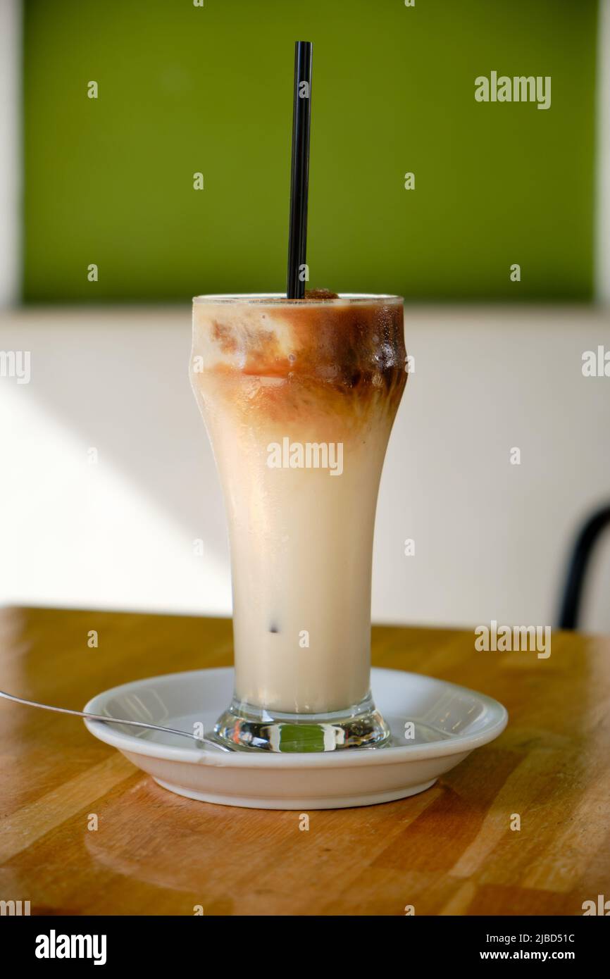 Close-up of a glass of authentic Horchata de Chufa with coffee shaved ...