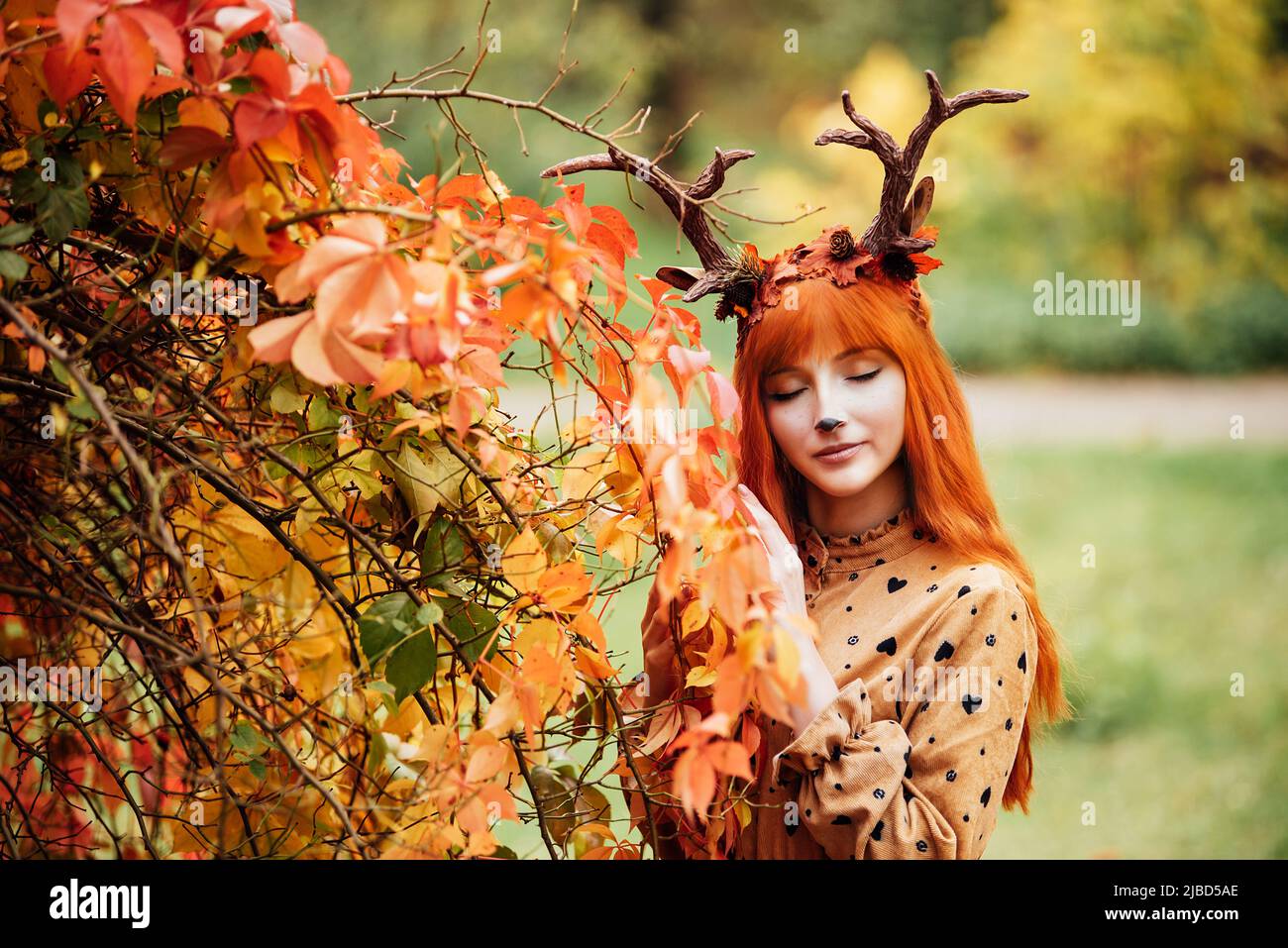 fairy woman with deer horns in autumn forest. Face painting. Beautiful ...