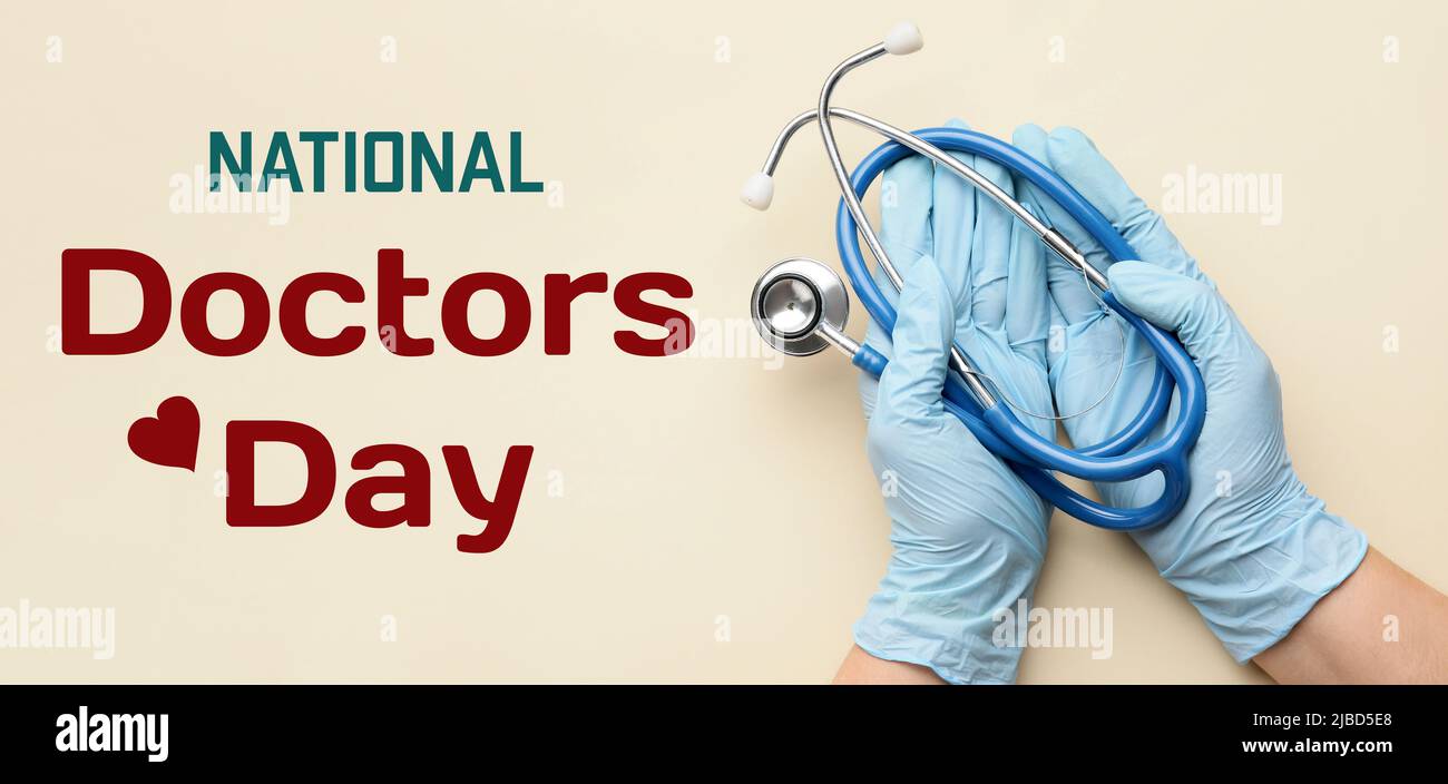 Hands of medical worker with stethoscope on light background. National ...