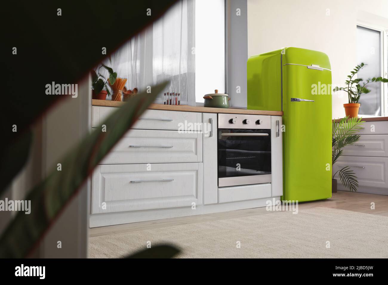 Interior of light modern kitchen with green vintage fridge Stock Photo ...
