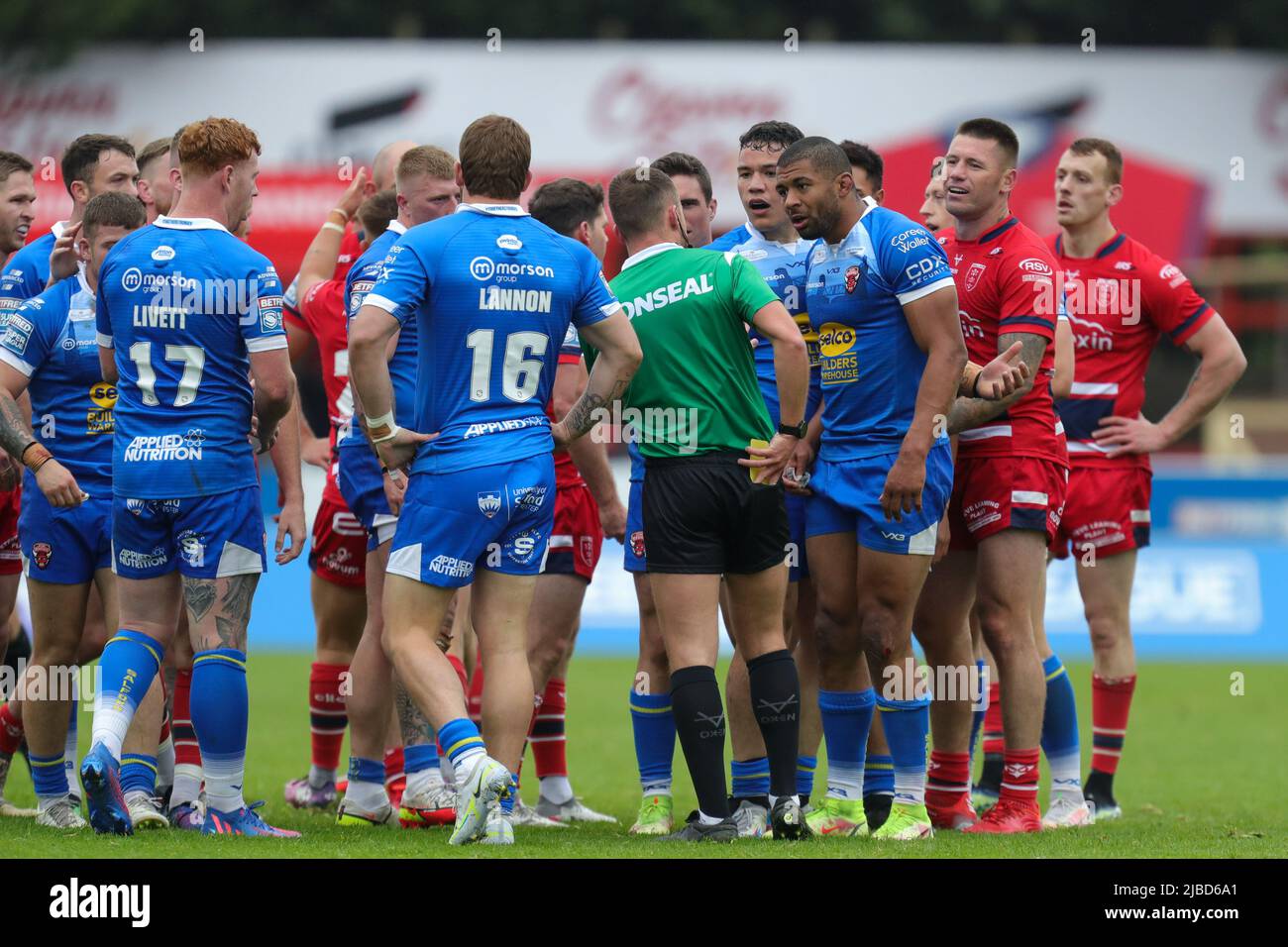 Referee Tom Grant attempts to diffuse the tempers between both teams in ...