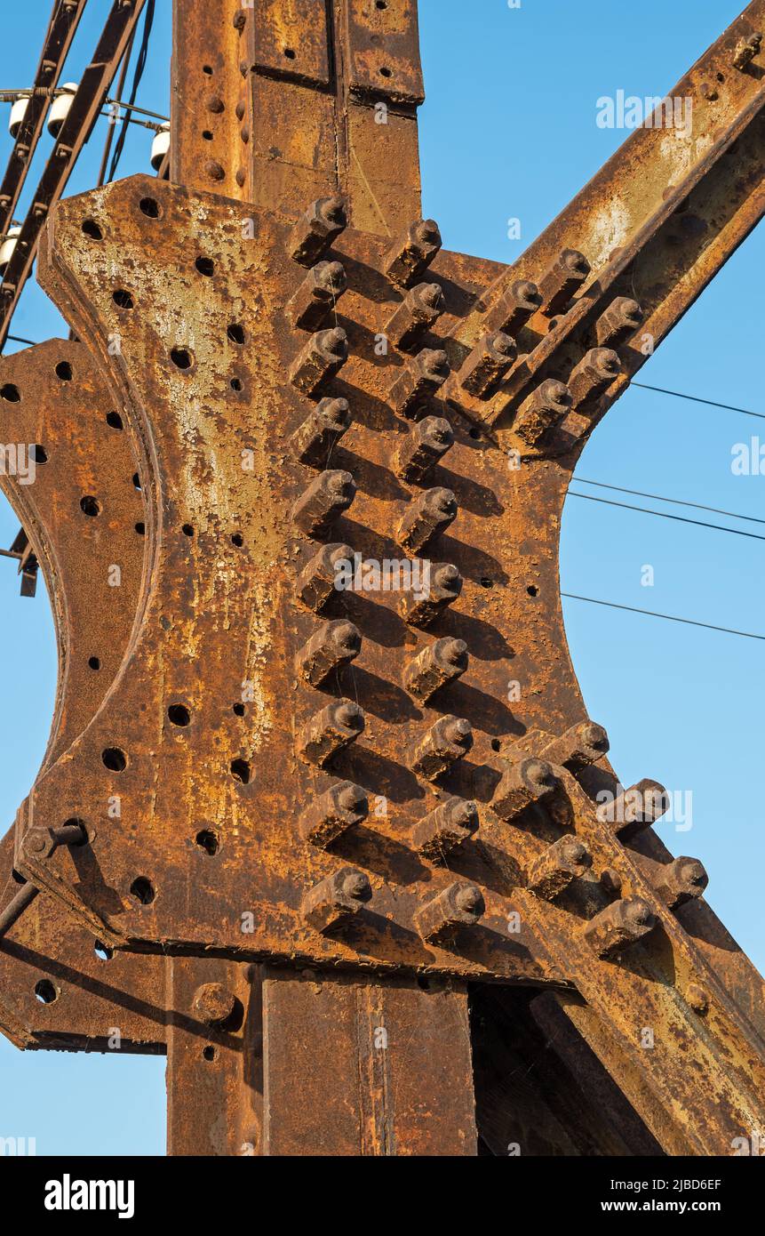 Rusted connecting knot from bolts and rivets of metal structures on ...
