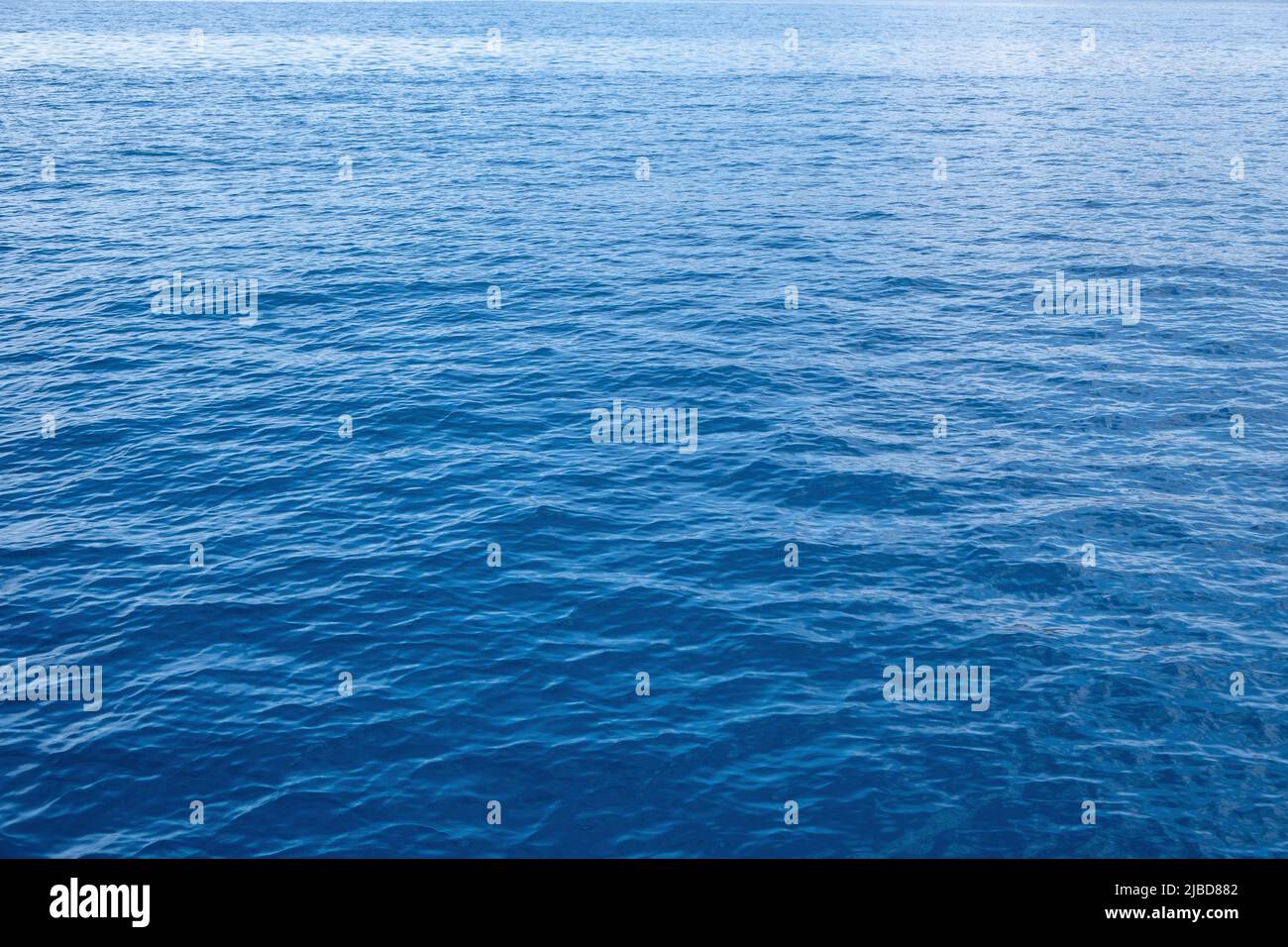 Sea water surface calm with small ripples. Ocean, deep blue color ...