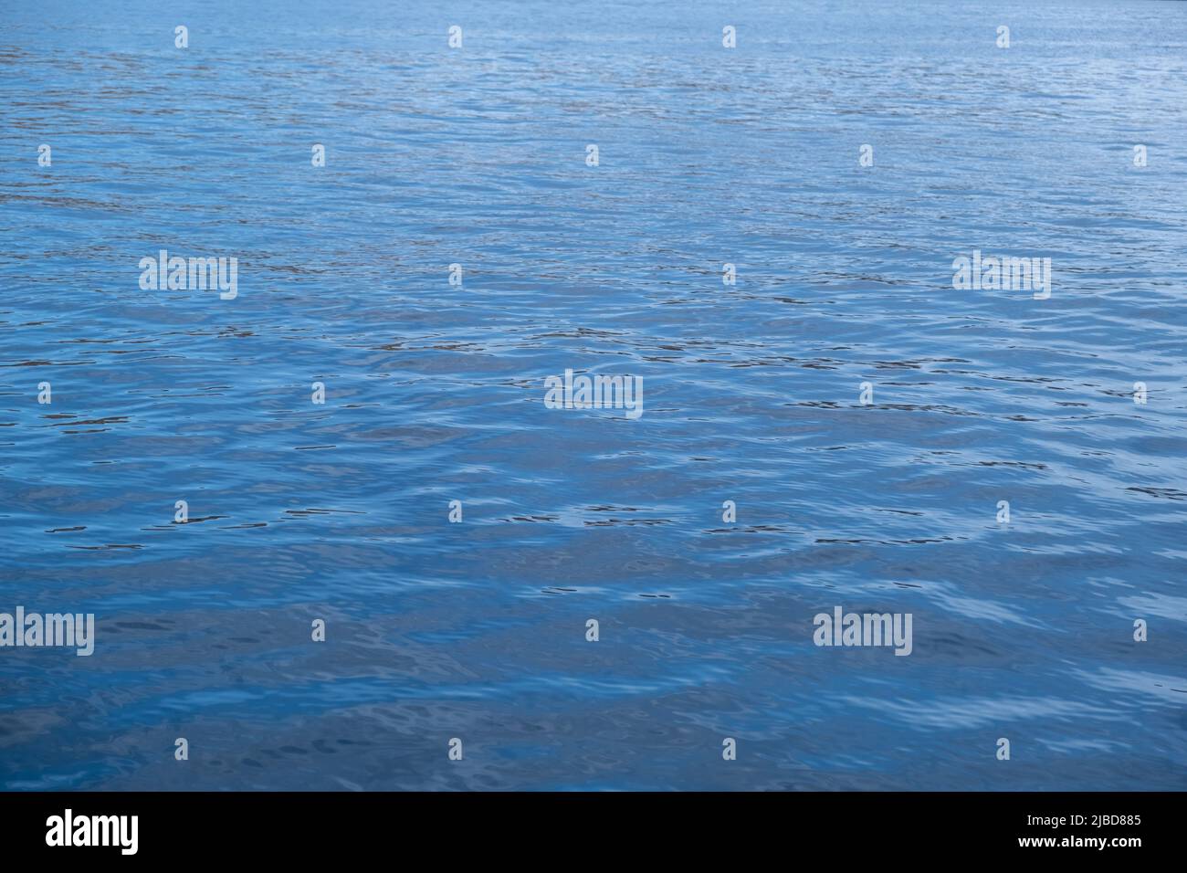Ocean, Sea water surface calm with small ripples. Deep blue color ...