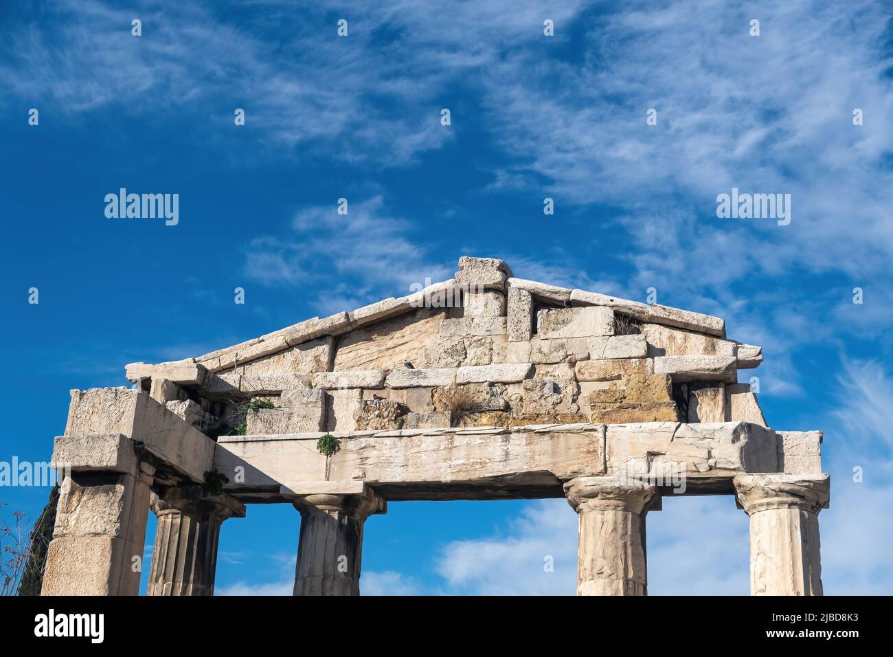 Roman Agora, Athens Greece. Gate of Athena Archegetis upper part, blue ...