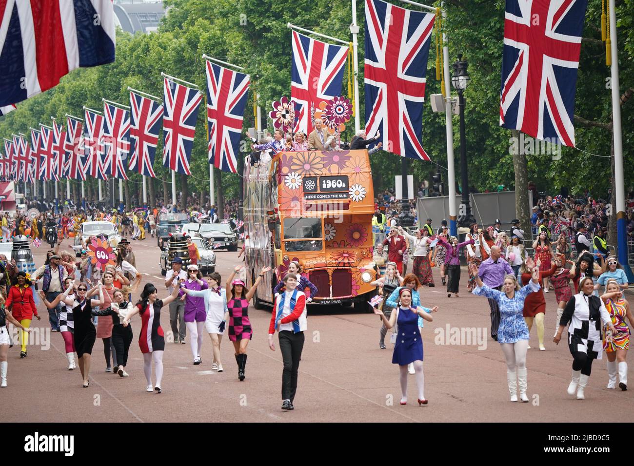 Dancers parade during the Platinum Jubilee Pageant in front of ...