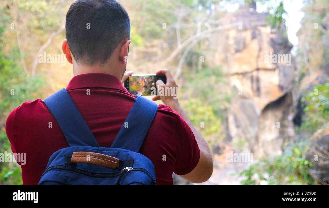 Happy man hiking woods hi-res stock photography and images - Alamy