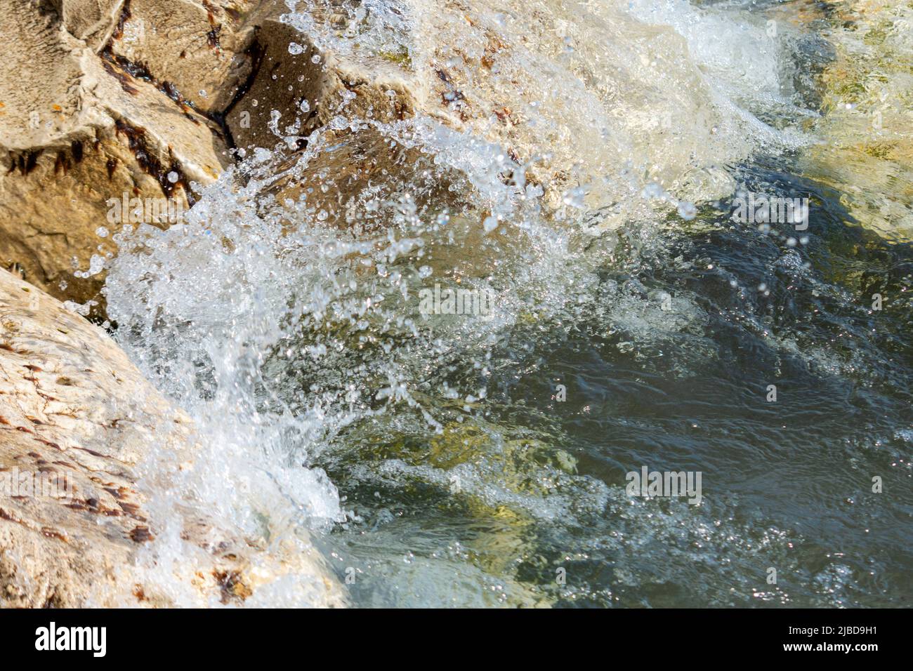 A wave crashes into the break wall at Coral Dock Park in Port ...