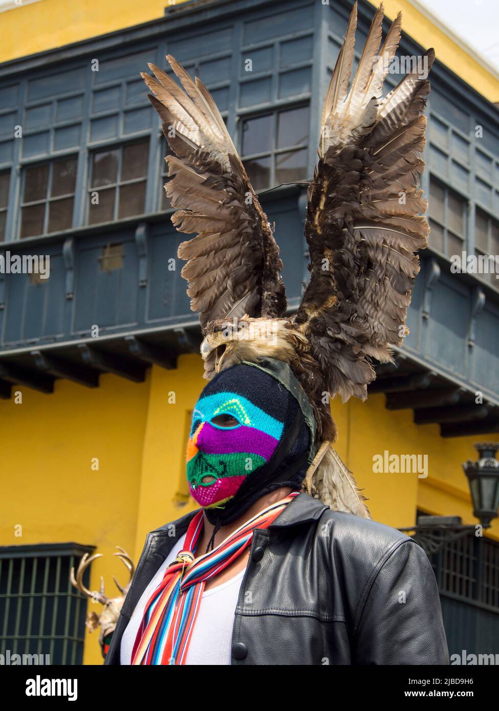 Indigenous with an eagle headdress and mask as part of Folkloric dance ...