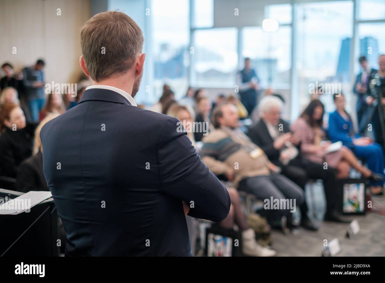 Business speaker talking to audience Stock Photo - Alamy