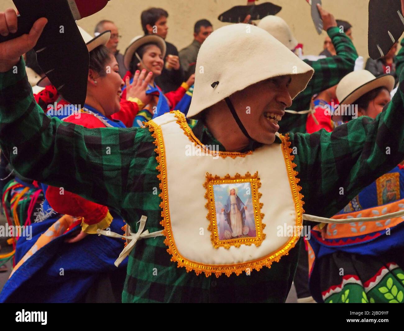 A man with a scapular performing an Andean dance. The municipality of ...