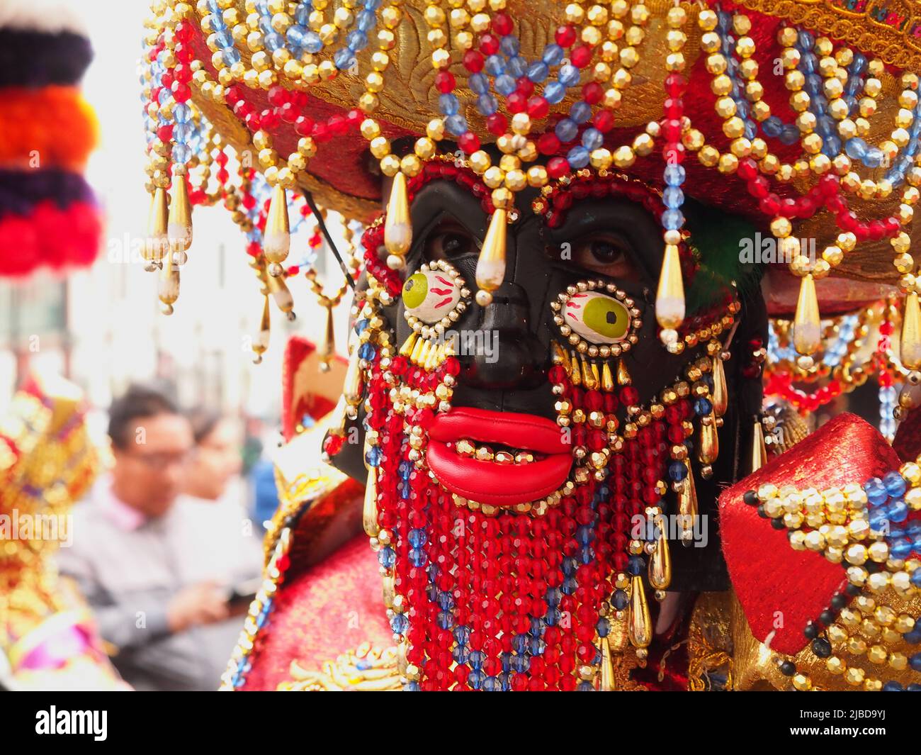 Dancer with the traditional mask of a black man. The municipality of ...