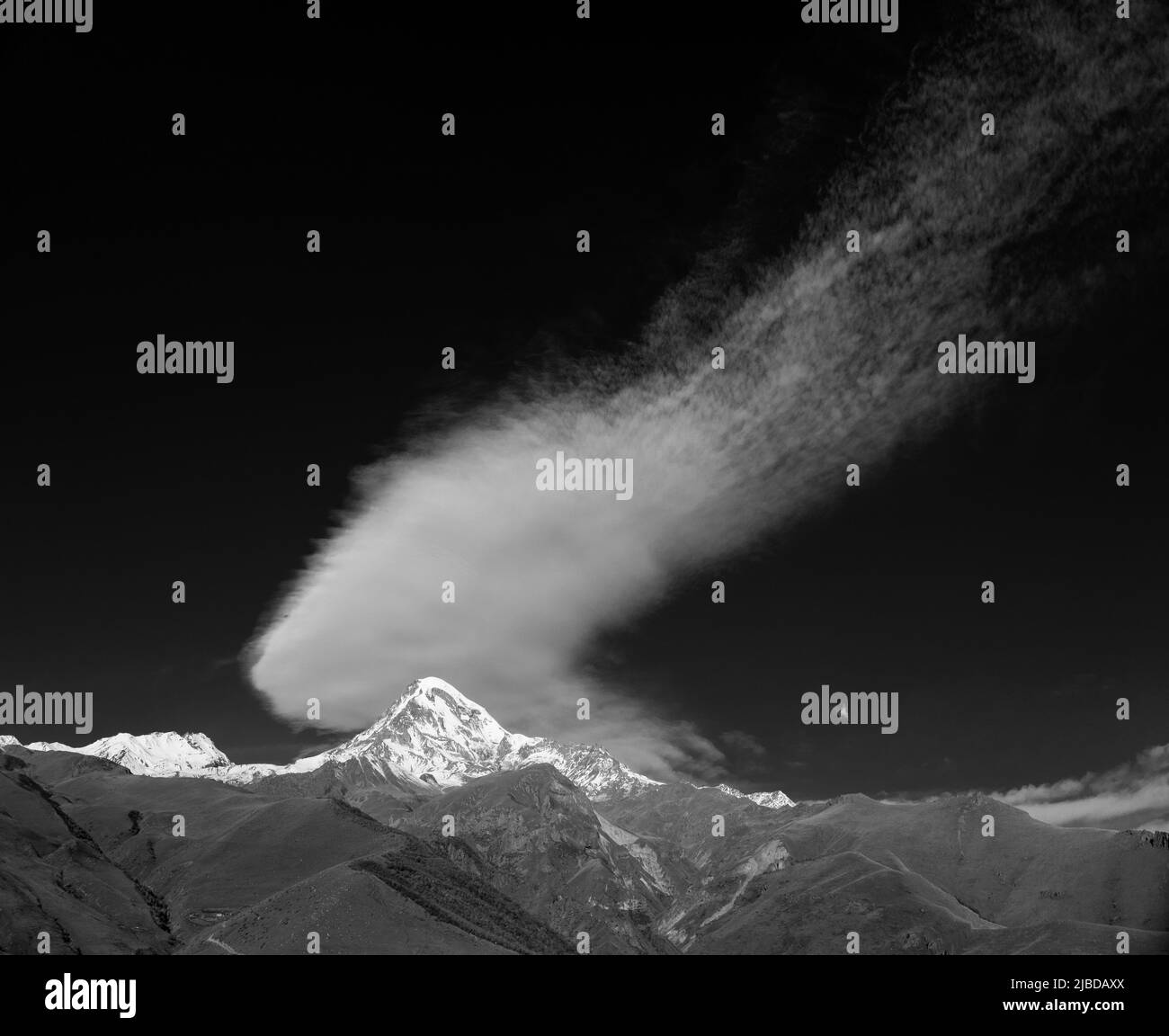 Mountain ridge with snowy peak Stock Photo - Alamy