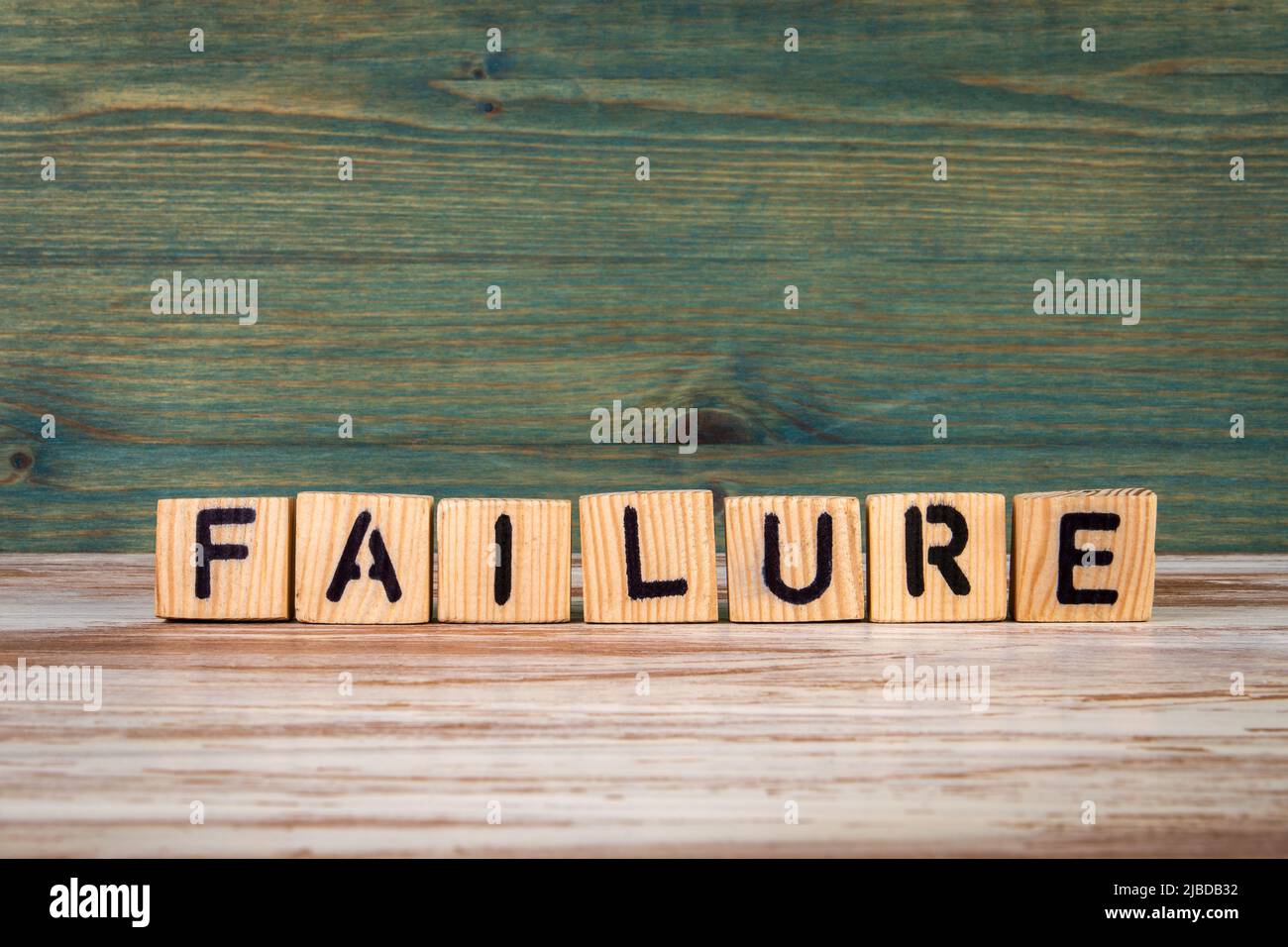 FAILURE. Text from wooden letters on a green and white background Stock ...