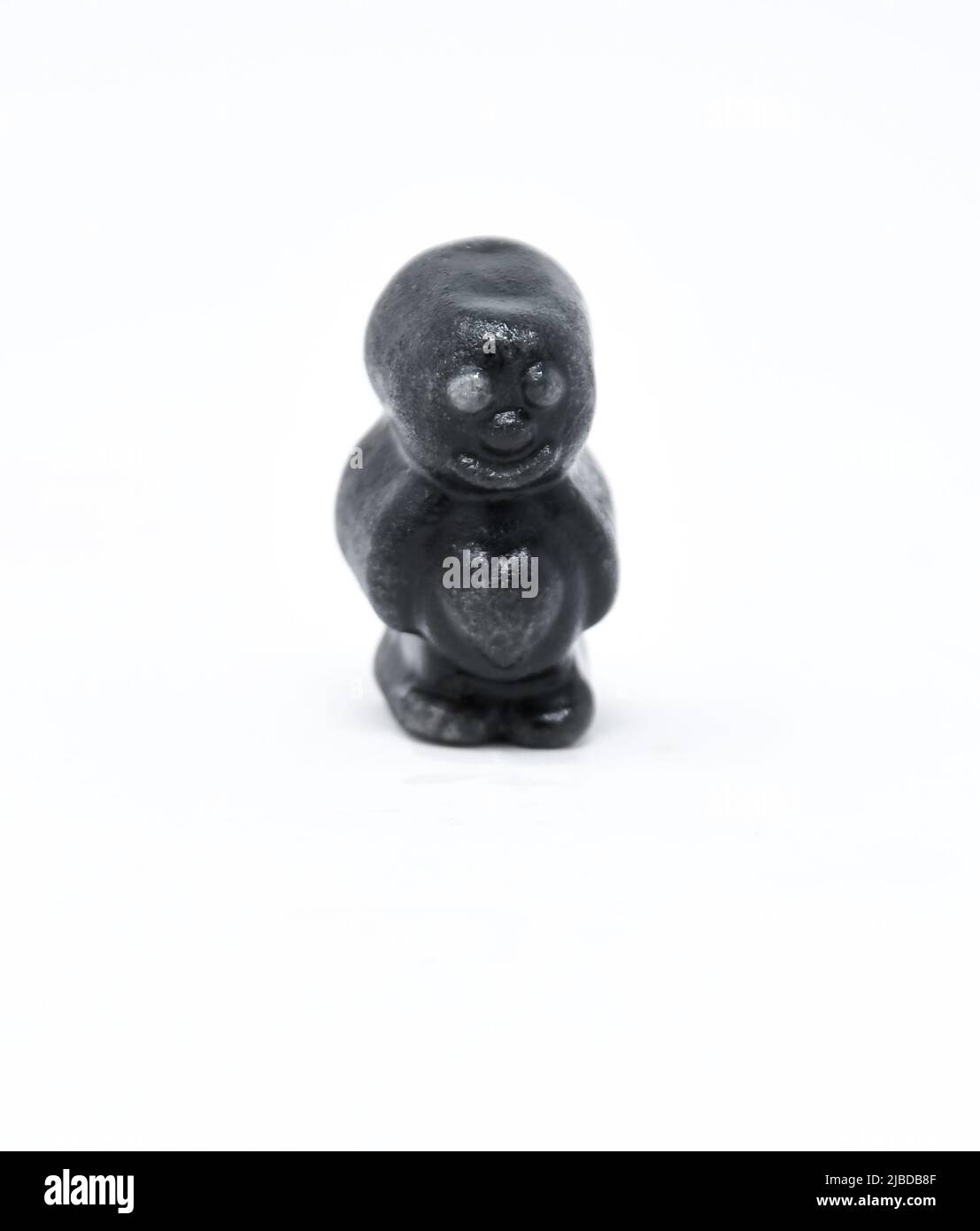 A close up photo of a Black Jelly baby Stock Photo - Alamy