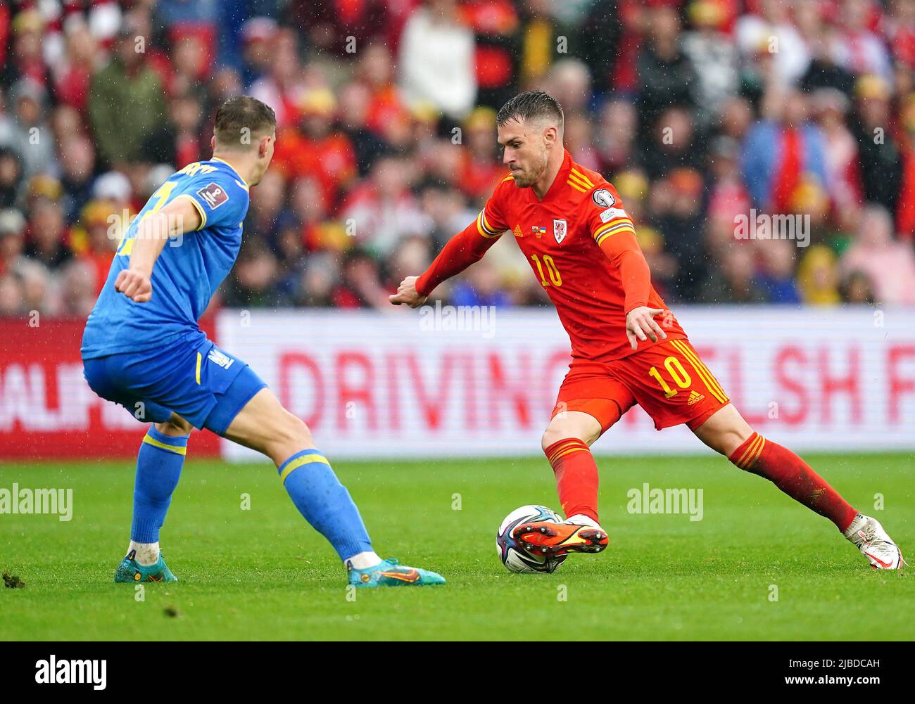 Wales' Joe Allen (left) and Ukraine's Andriy Yarmolenko battle for the ...