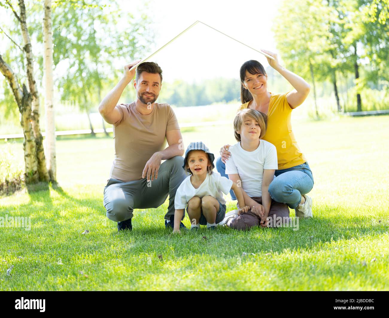 Concept of mortgage and housing for young families. Mother father and ...