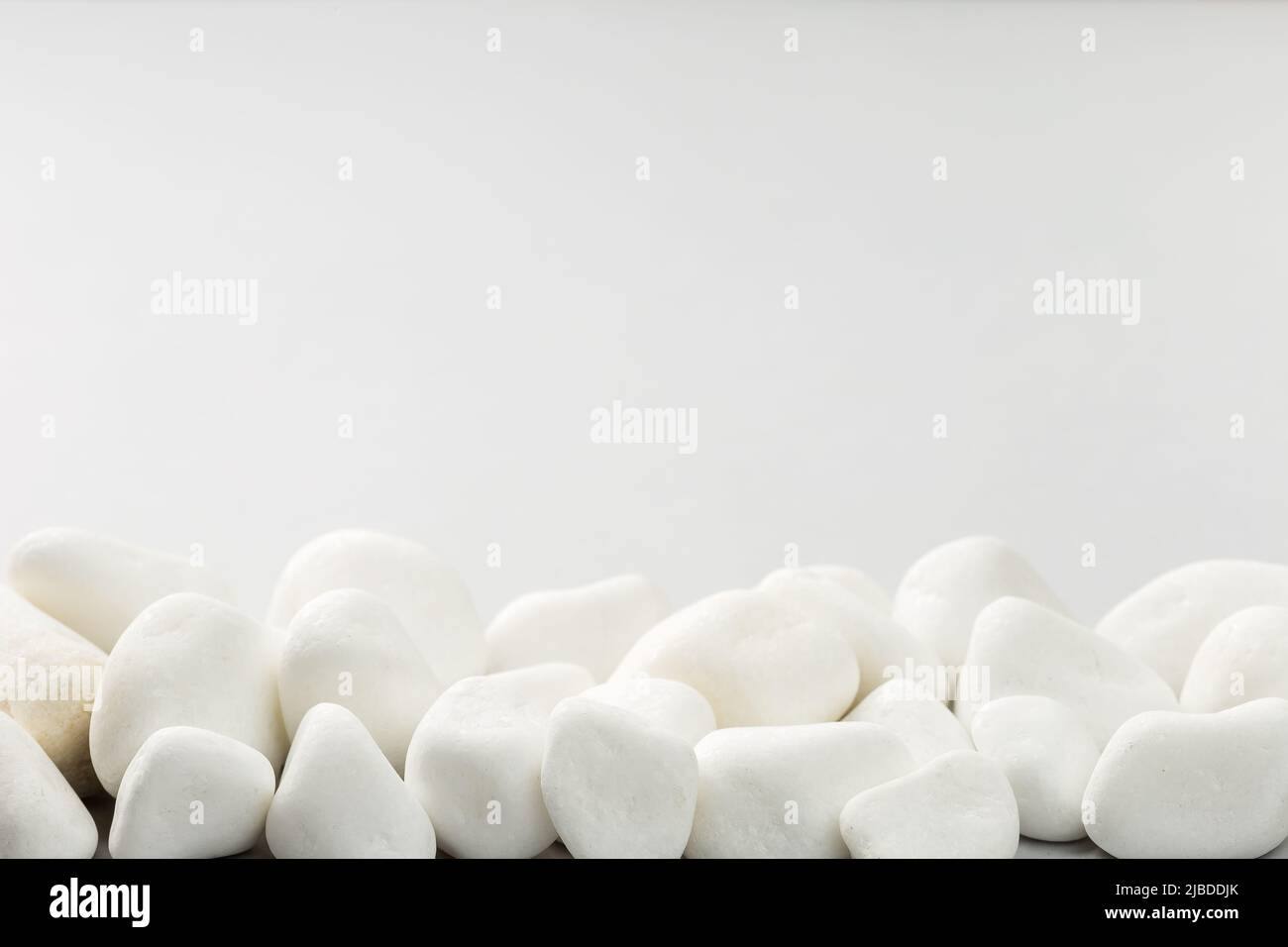 White stone on the grey background. Rock bottom border Stock Photo - Alamy