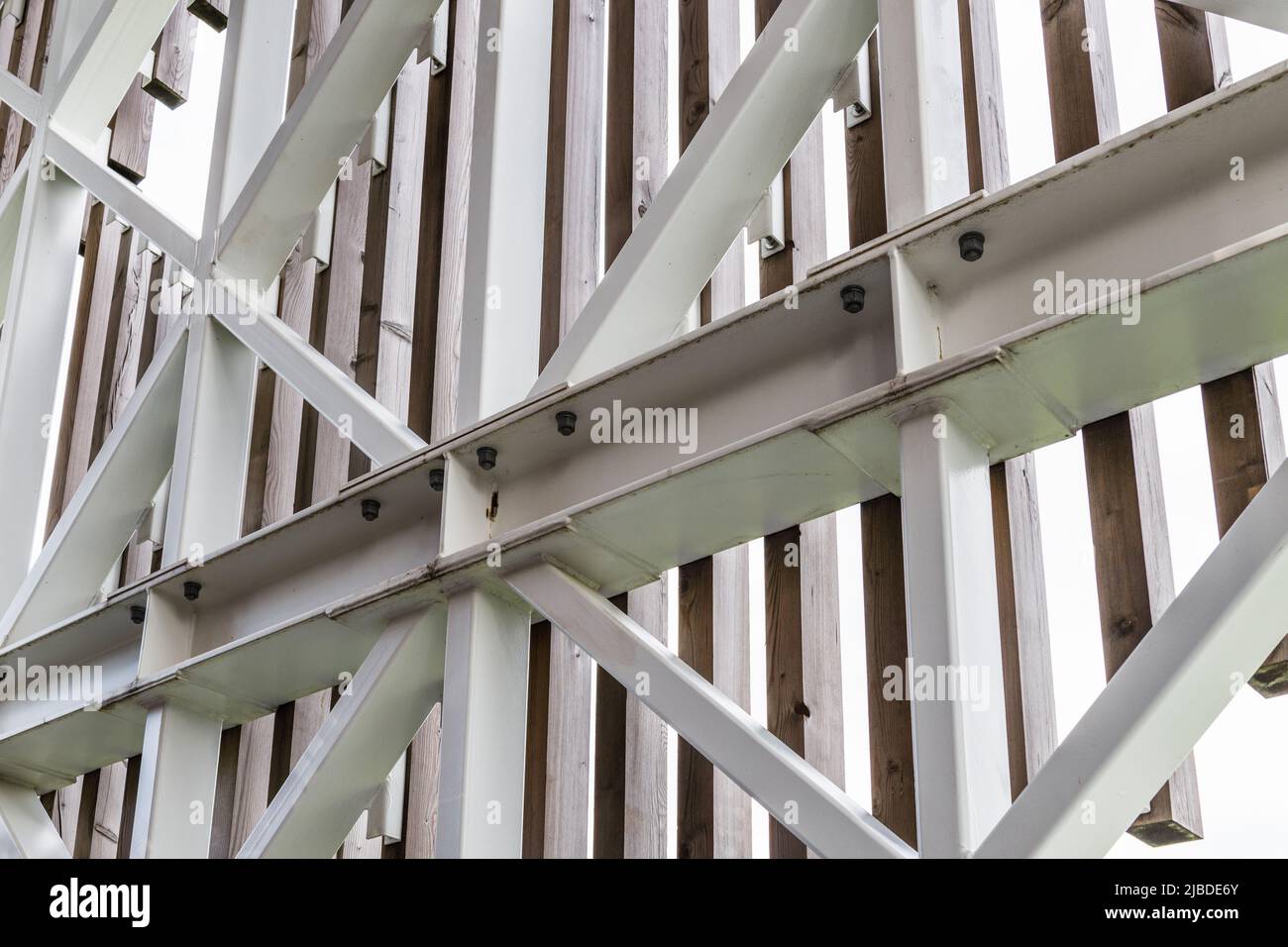 Massive steel beams end-to-end with bolts and nuts on the construction ...