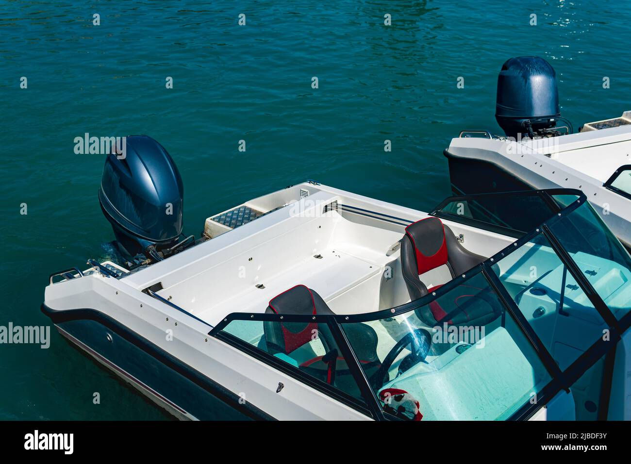 two moored motorboats with outboard motors Stock Photo - Alamy