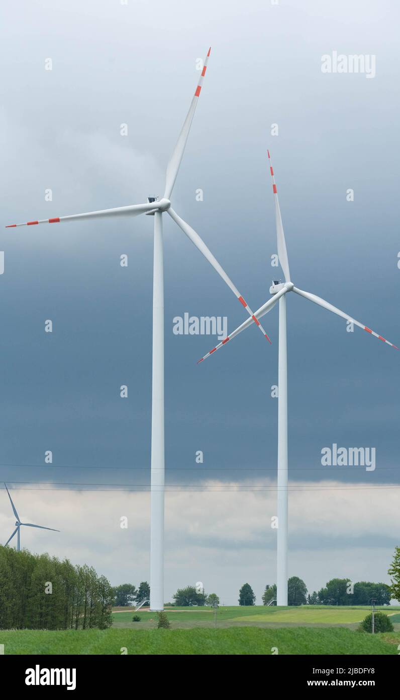 Wind farm in Poland. Windmills in arable fields. Renewable energy ...