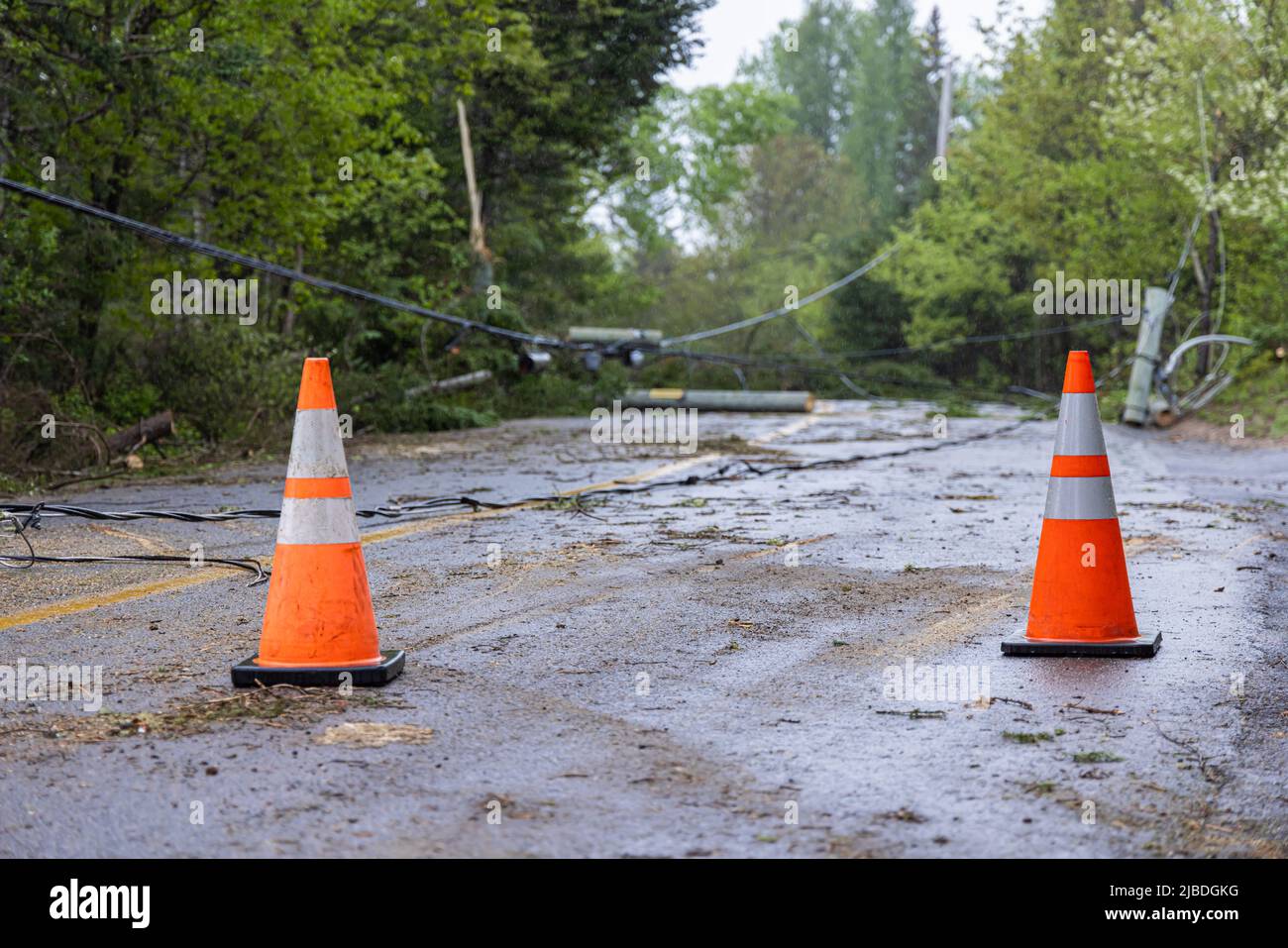 Two traffic cones are used to warn traffic of road closure due to ...