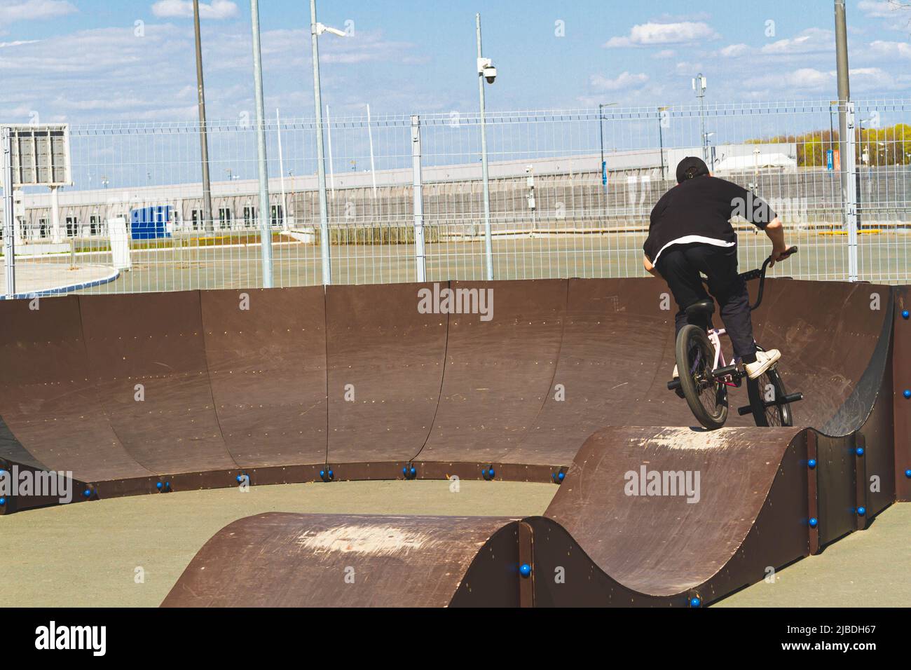 Cycling on the track. The cyclist rides on the hills of the track ...