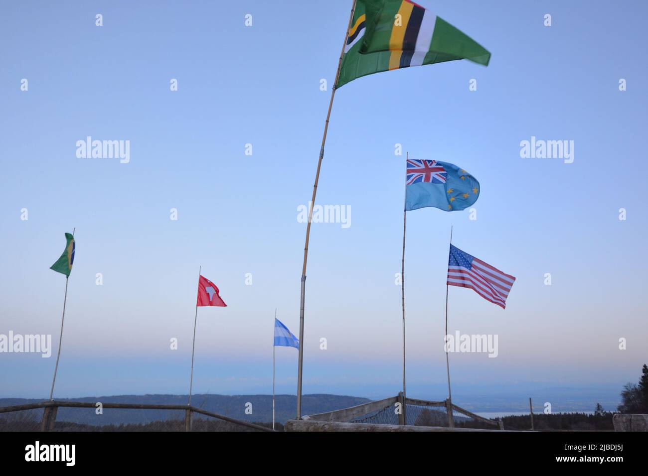 Flags waving in the wind in the swiss jura, la vue des alpes Stock ...