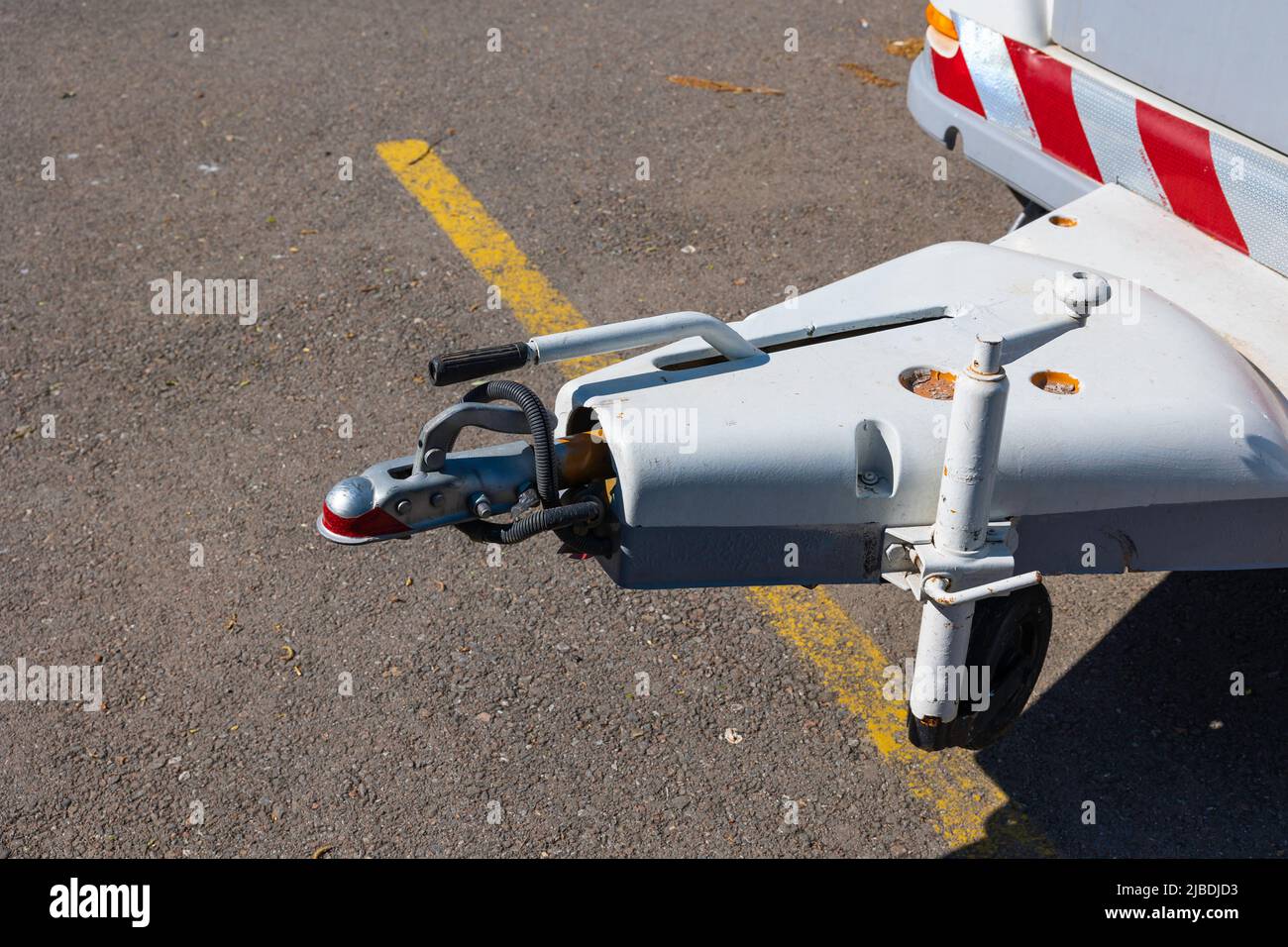 Coupling of a trailer or caravan in focus. Details of the hook or ...