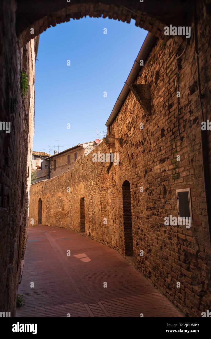 Narrow Lane In The Center Of San Gimignano On A Sunny Morning Stock ...