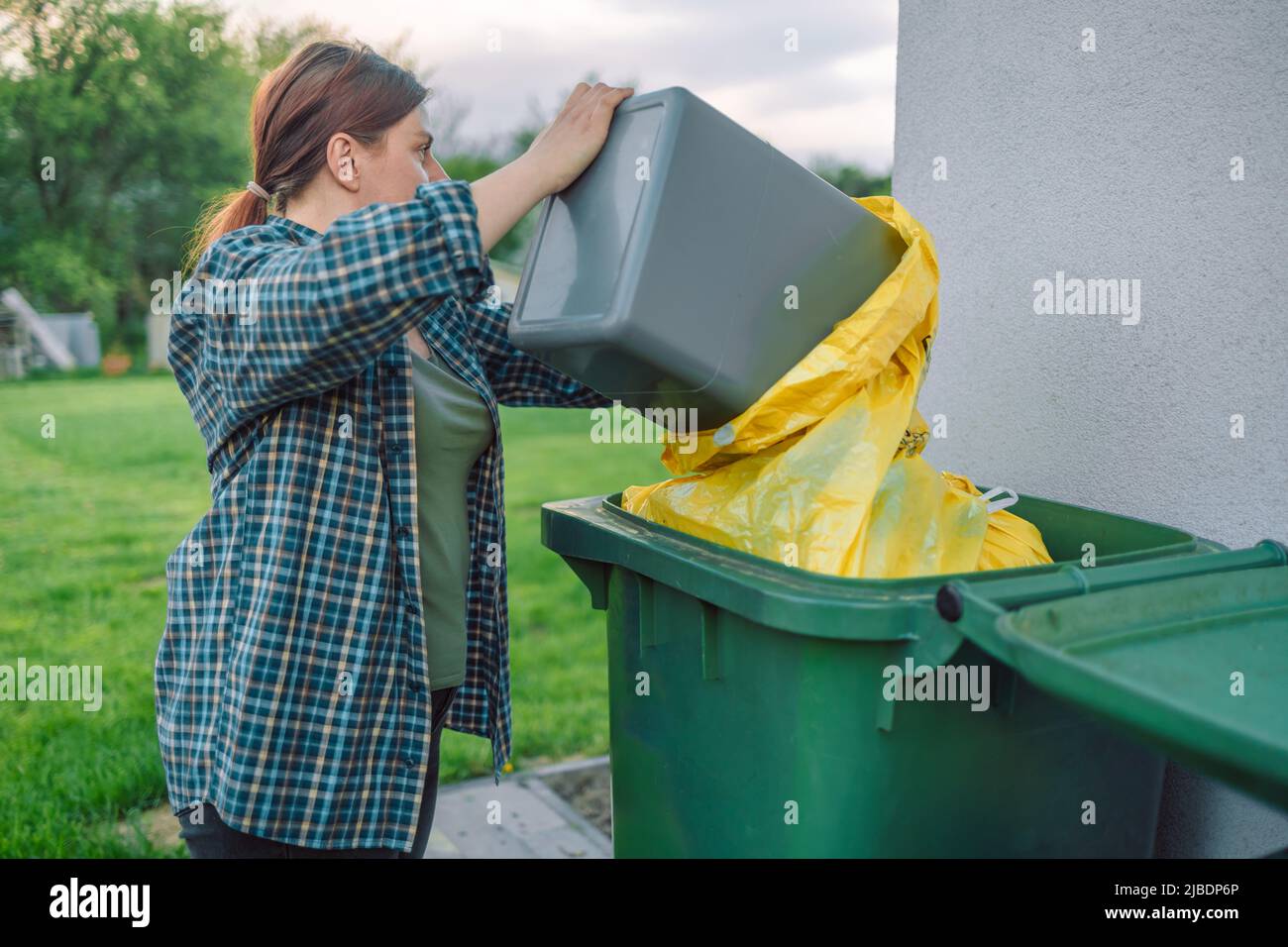Woman throwing food bin hi-res stock photography and images - Alamy