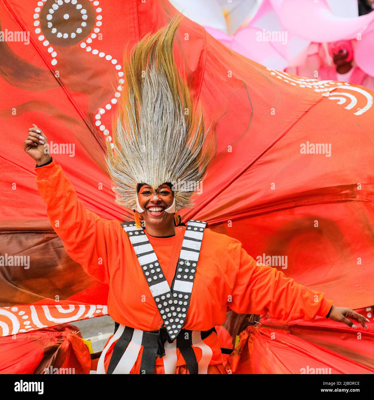 London, UK. 05th June, 2022. A participant beams at the crowds in her ...