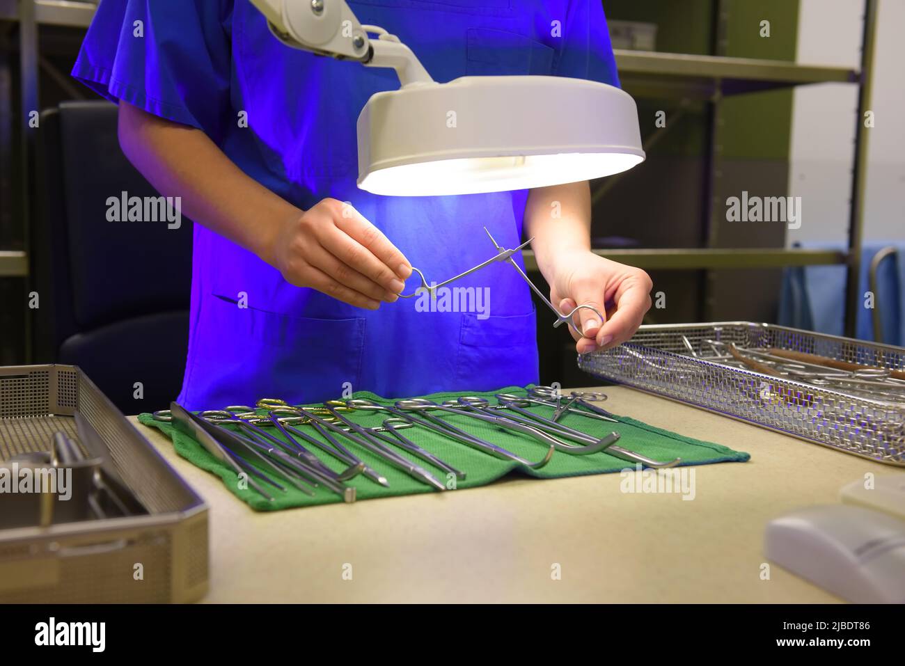A girl works in a hospital as a medical hygiene worker. Dressed in ...