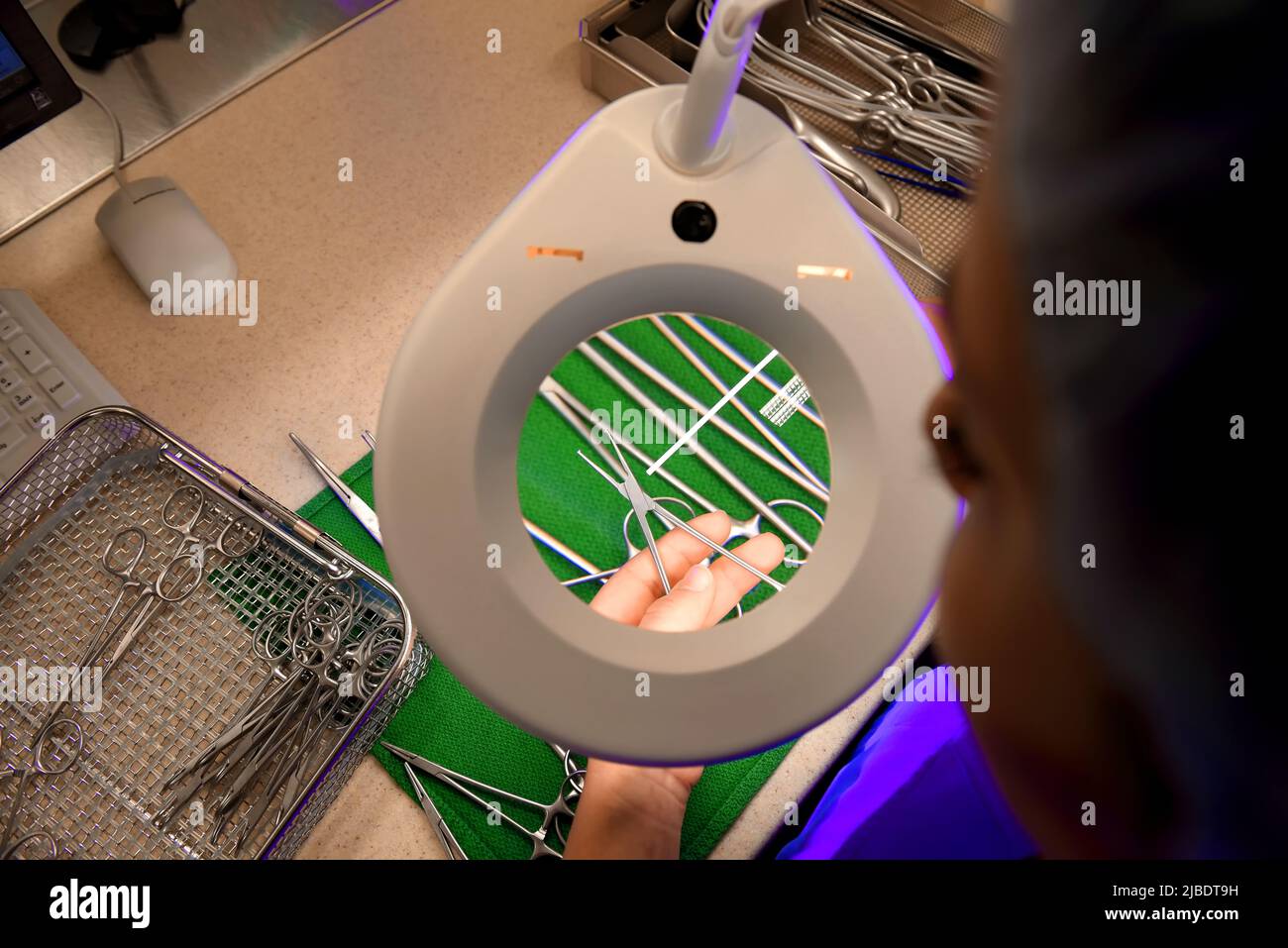 A girl works in a hospital as a medical hygiene worker. Dressed in ...